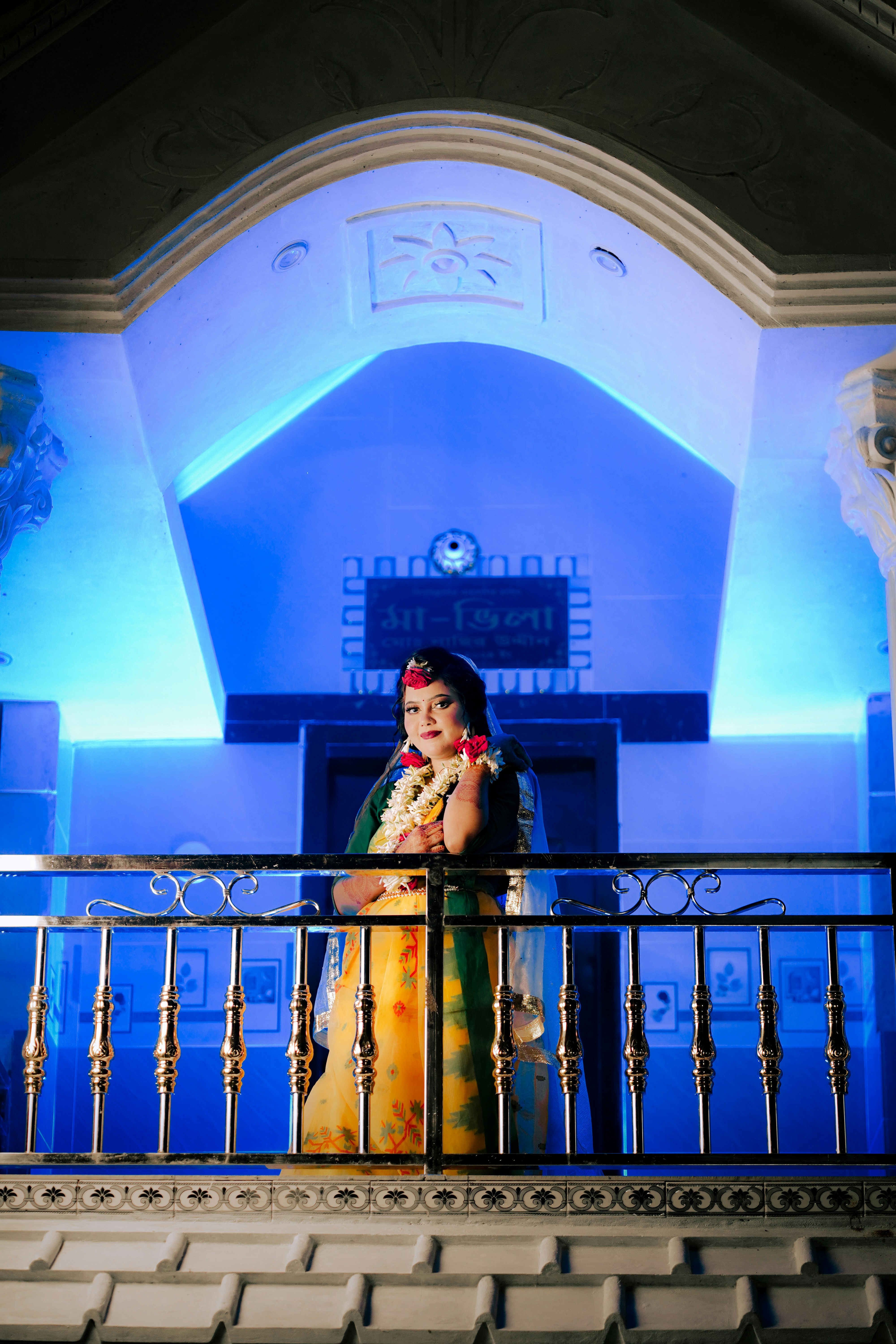 Garlanded Grace on a Sapphire Balcony