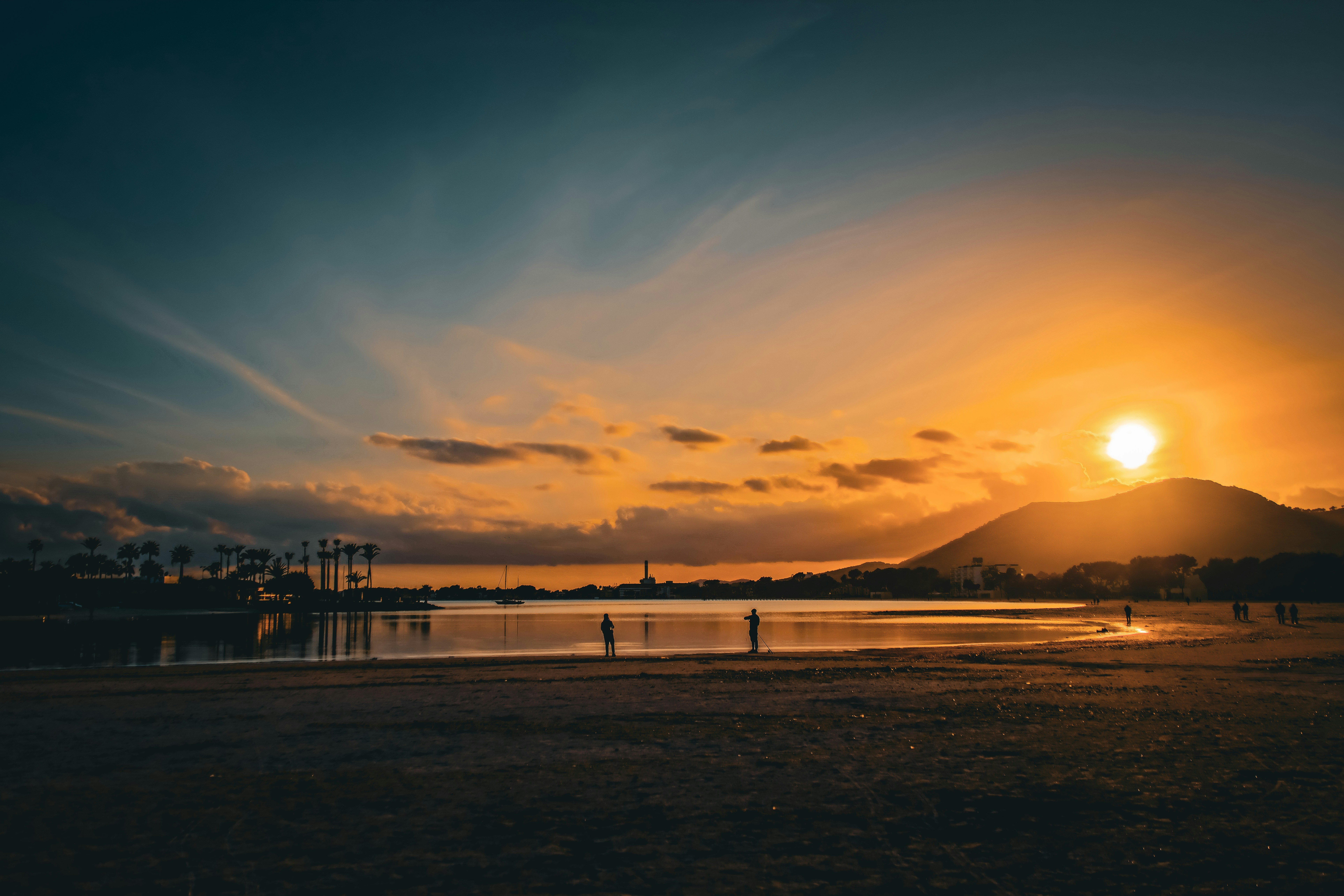 Golden sunset over a calm lake with distant hills. photo – Free Beach ...