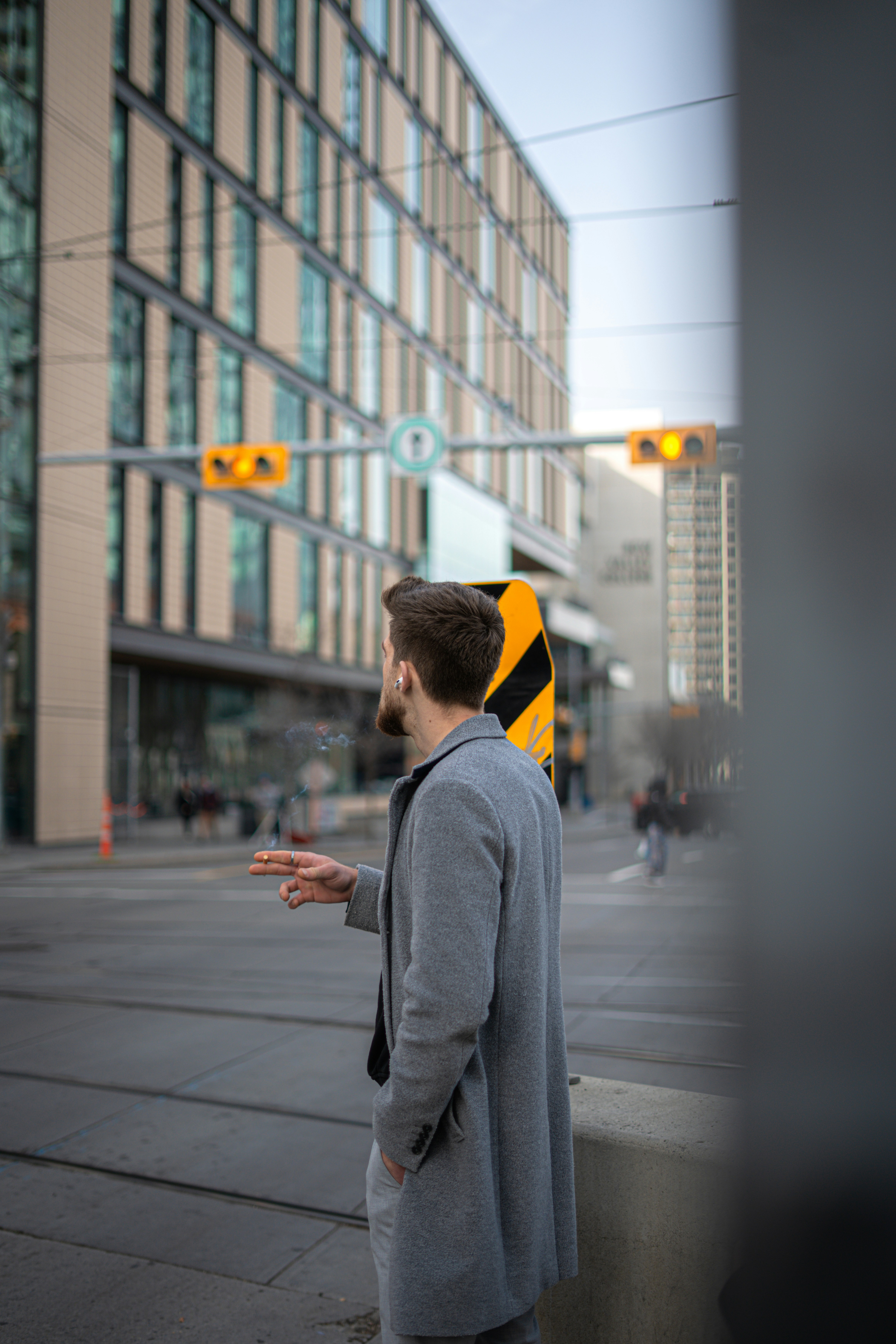 Gesture by Steel and Light: A Street Portrait in Soft Focus