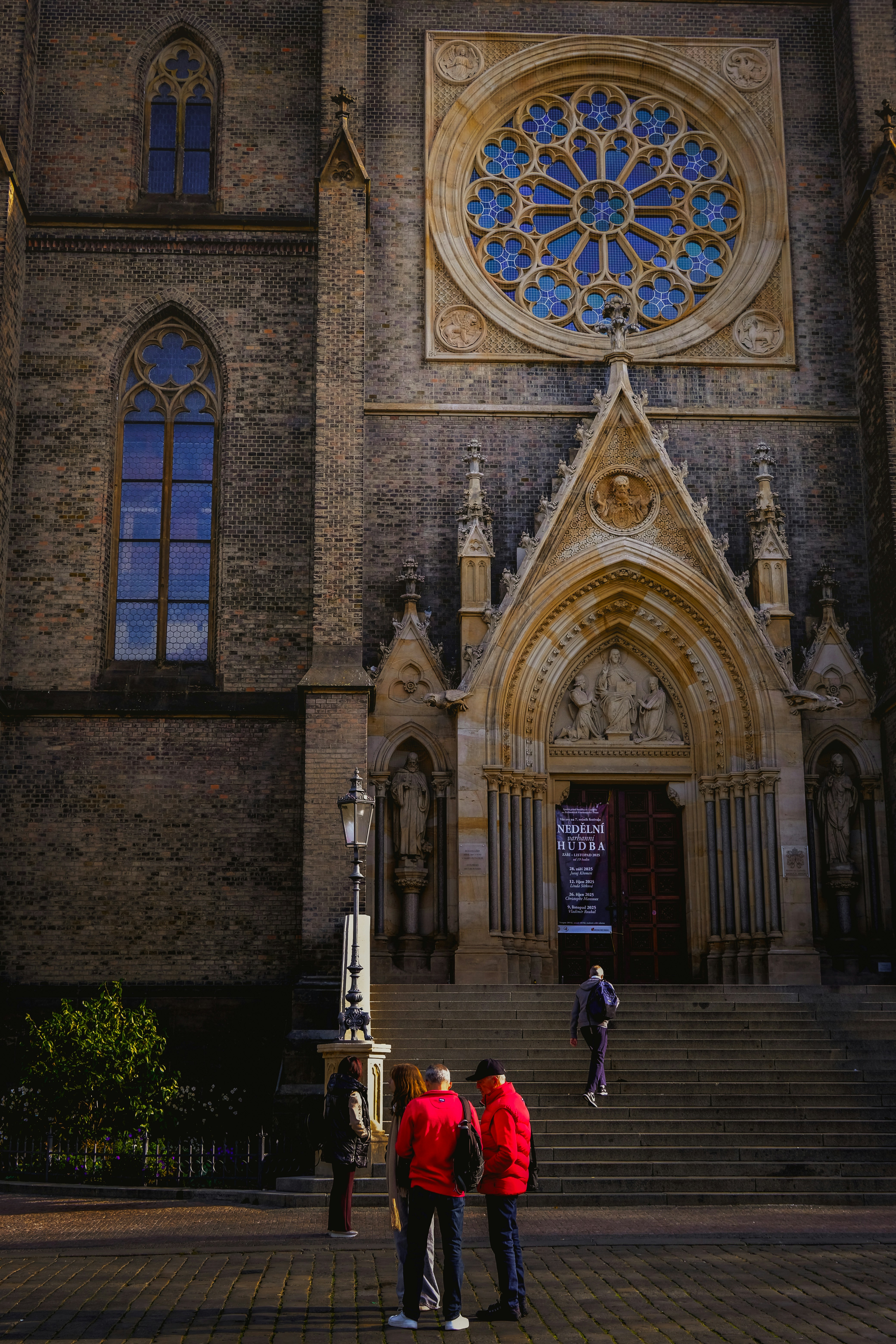 Rose Window Gateway: Visitors at the Gothic Cathedral Steps
