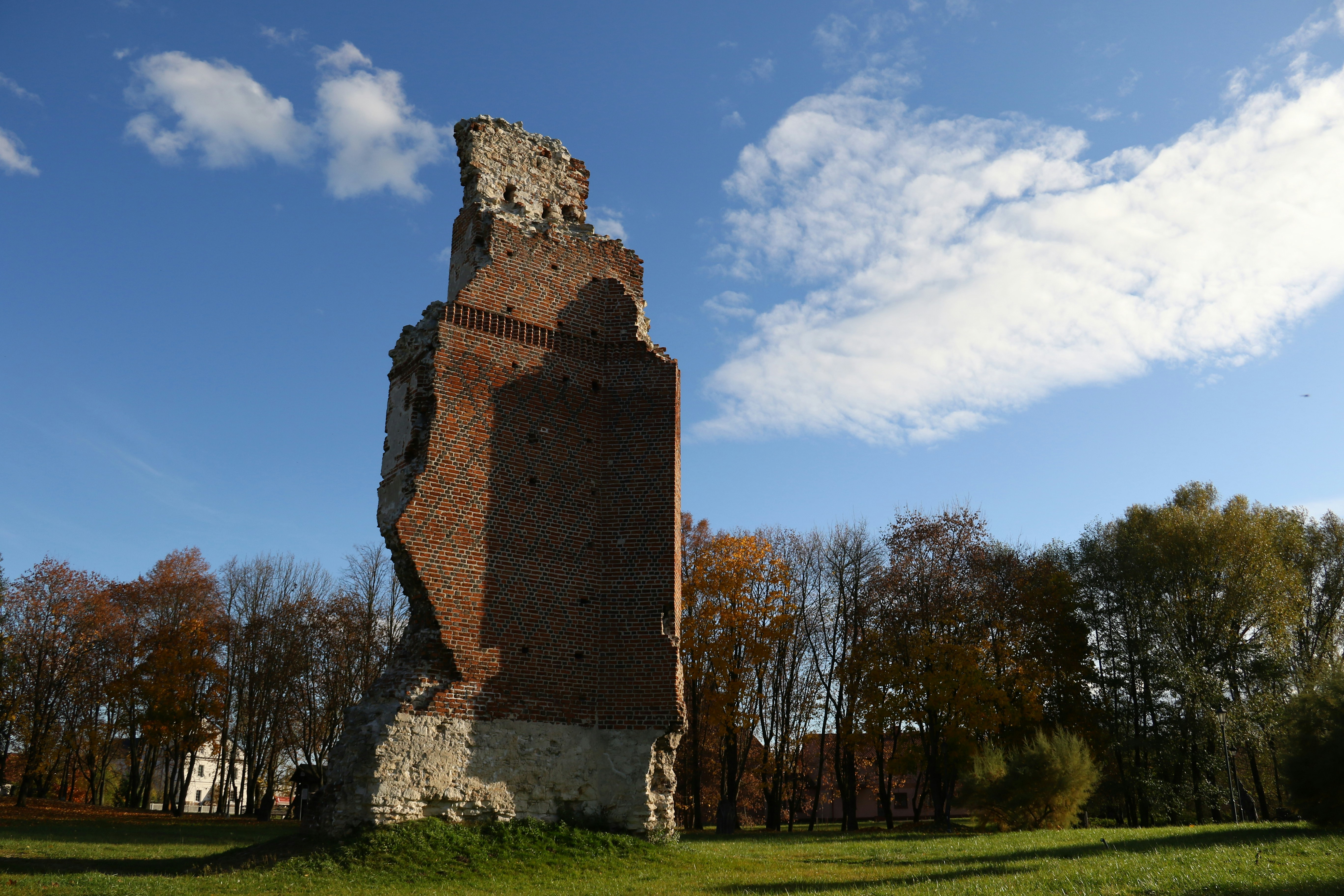 Brick Ruin Rising Over a Sunlit Autumn Meadow