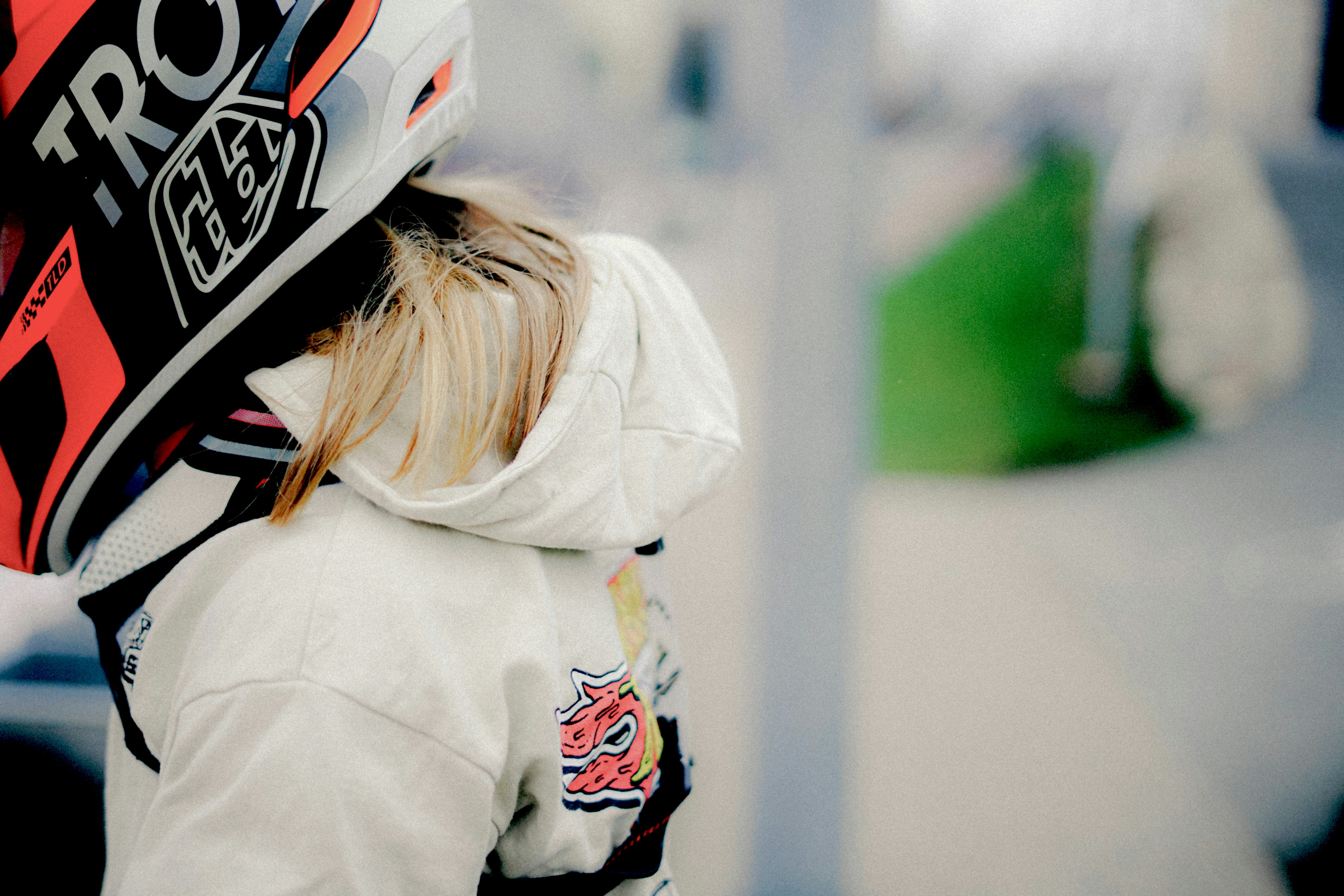 Helmeted Moment: A Quiet Portrait of a Racer in White