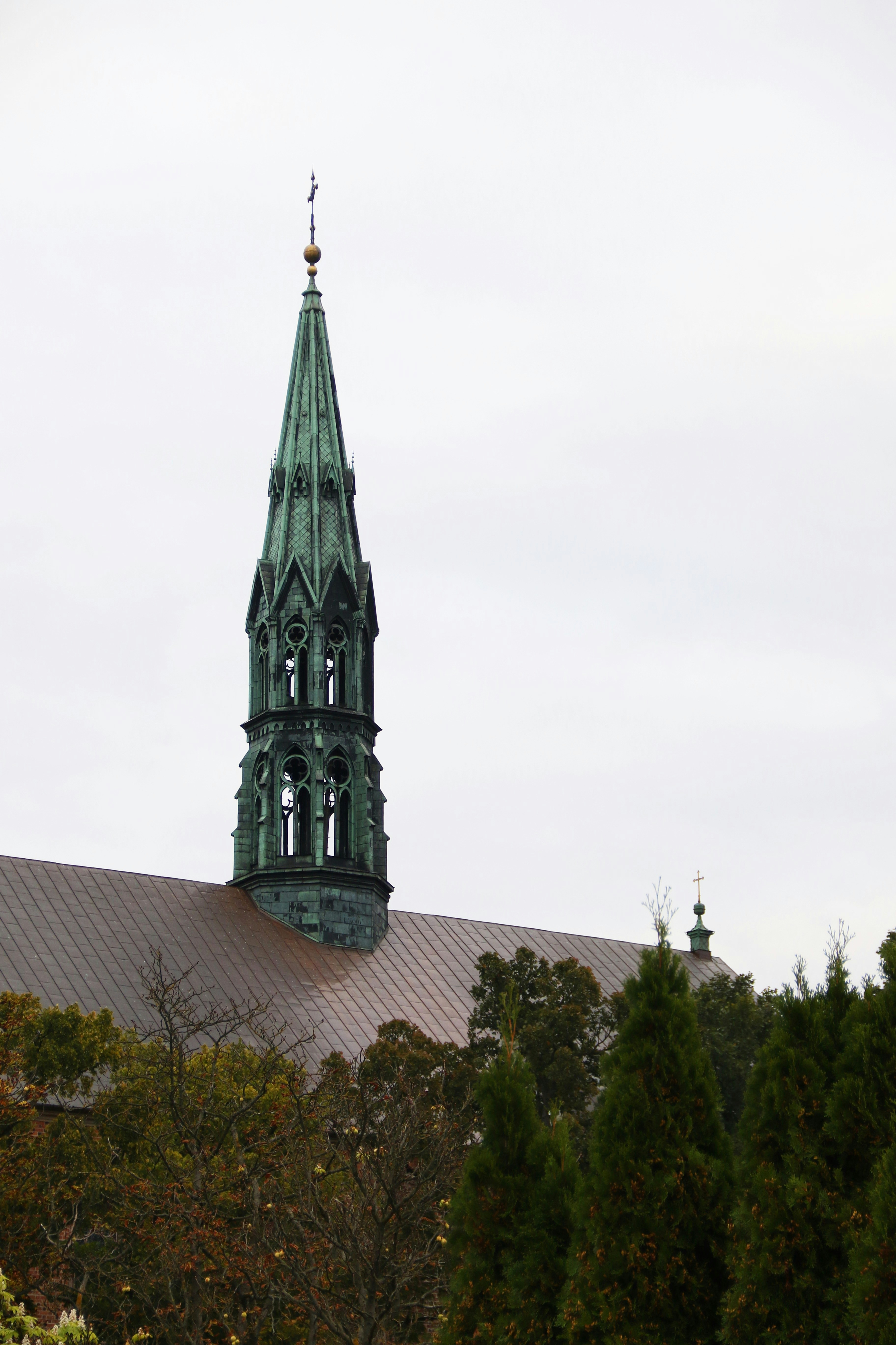 Emerald Spire: A Green Pinnacle Over a Quiet Rooftop
