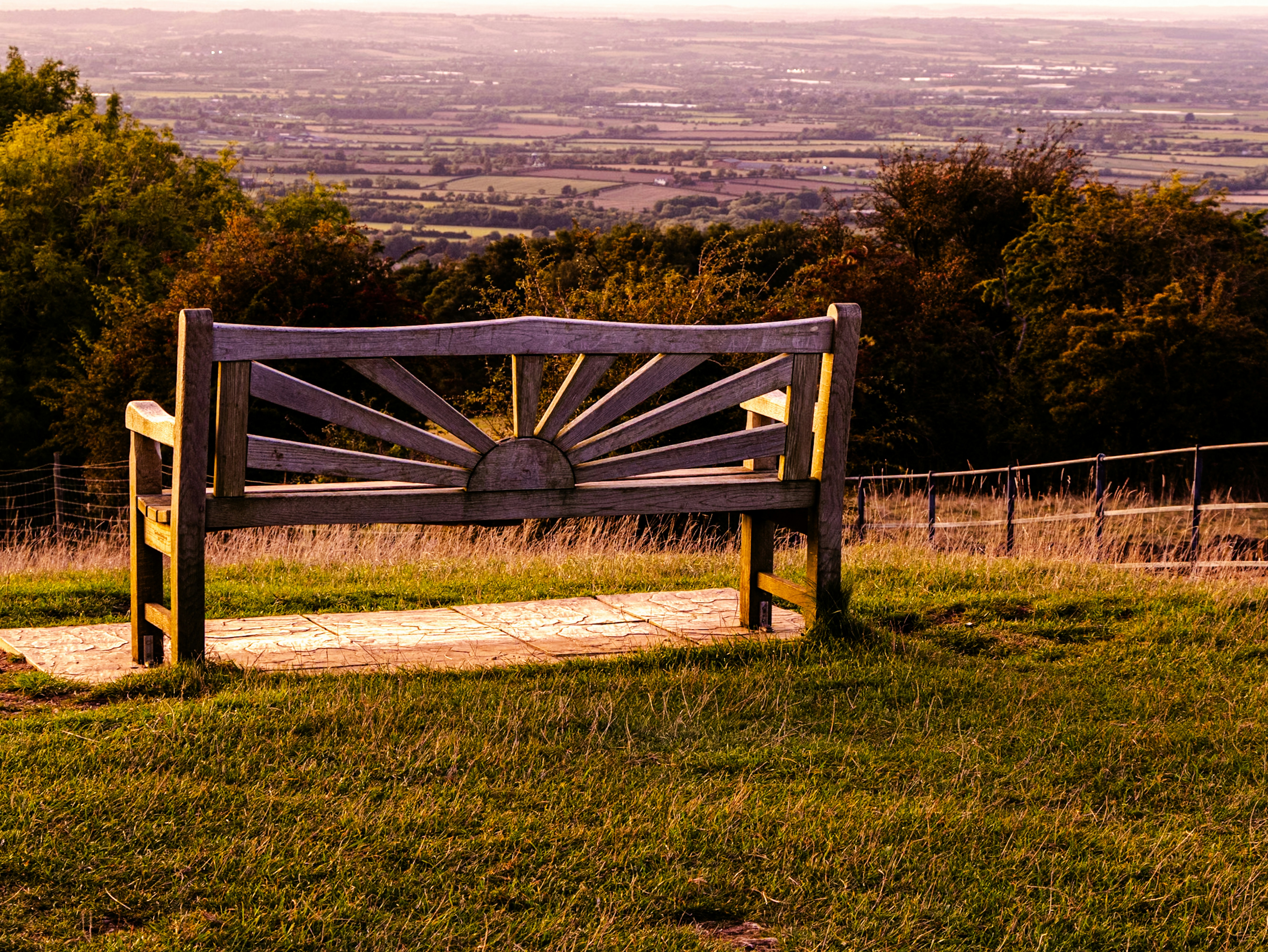 Sunset Rail-Fence Gate: A Lone Bench at the Edge of the Hill