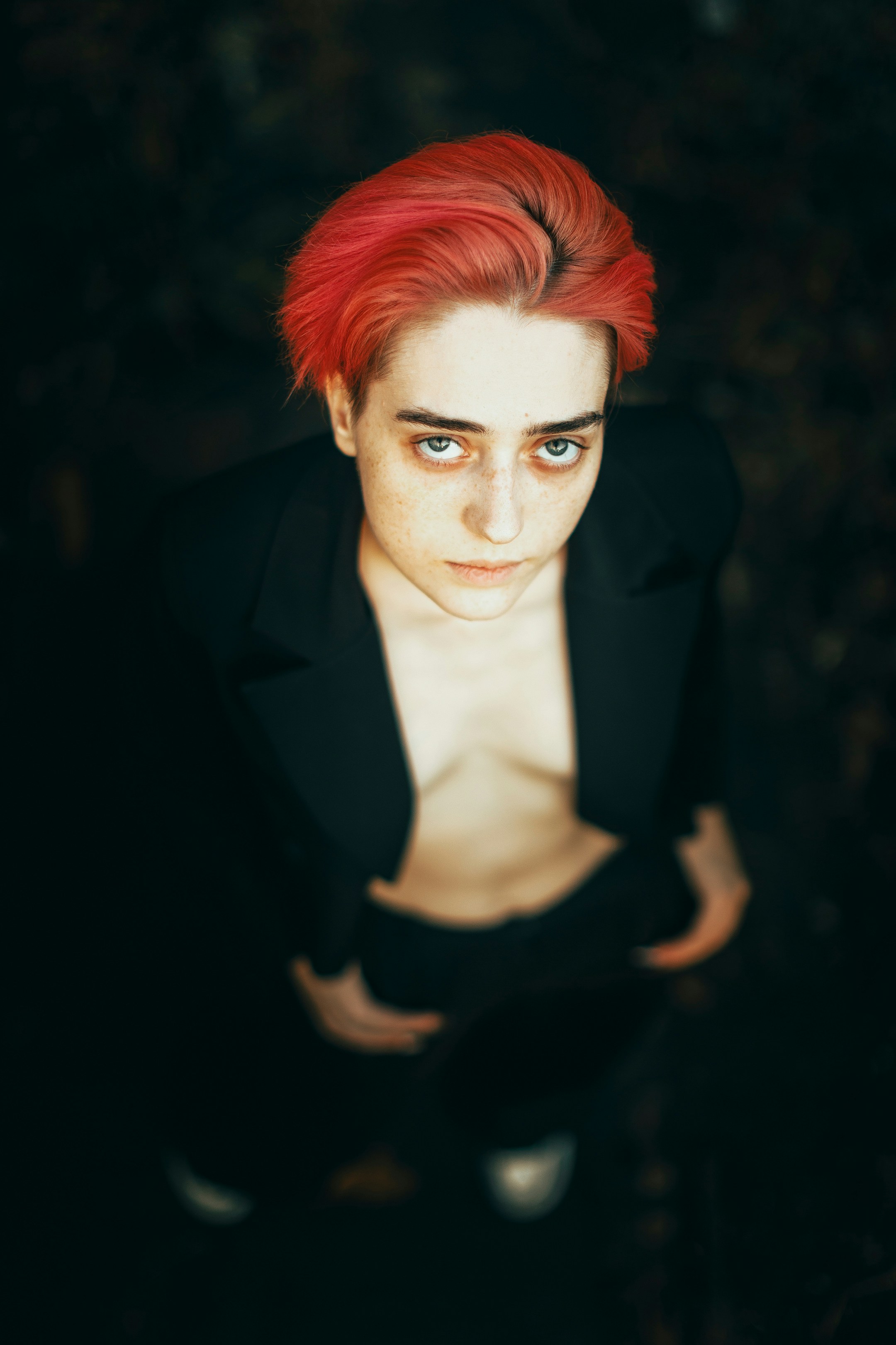 Crimson Gaze from Above: A High-Angle Portrait with a Bold Look