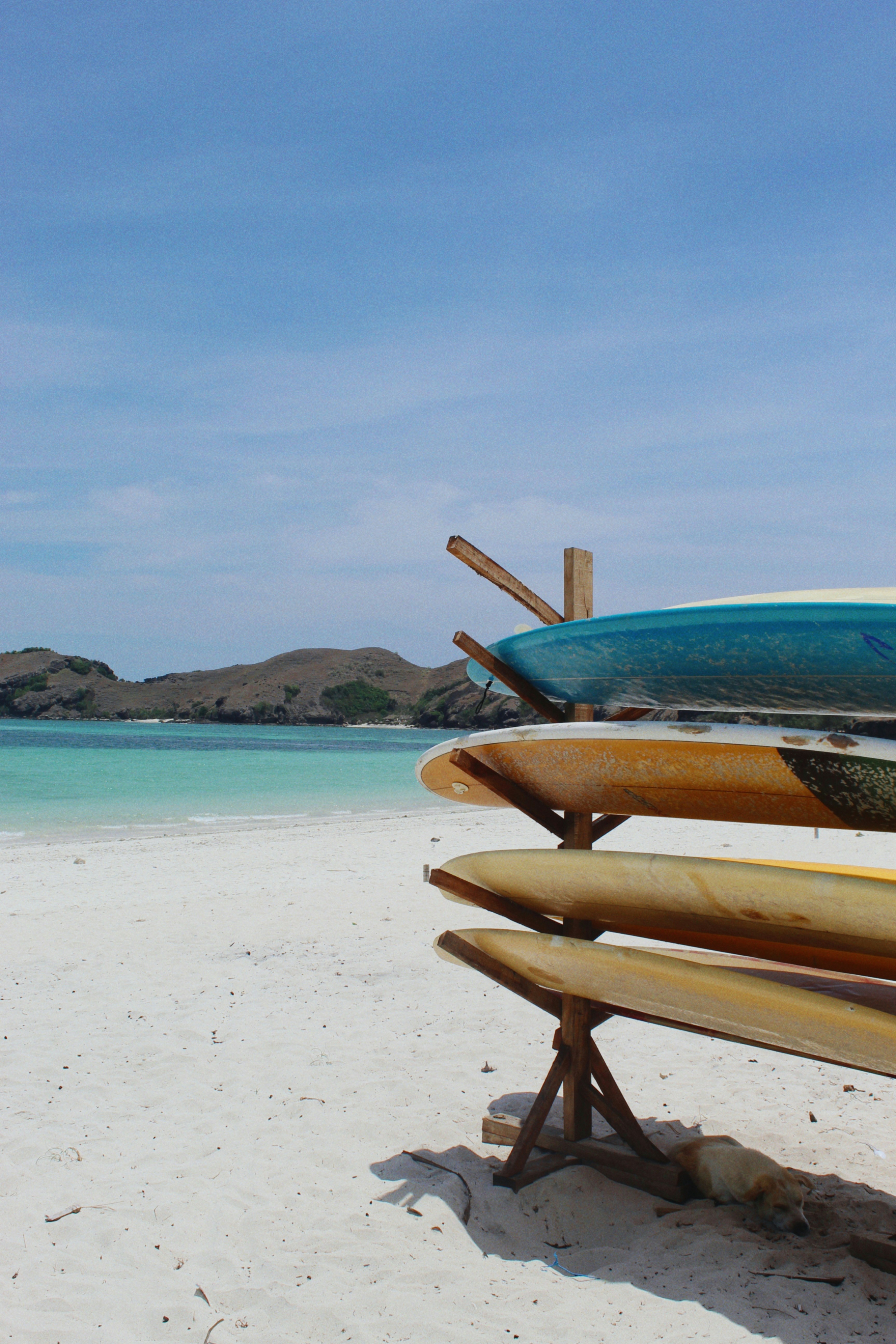 Sun-bleached Surfboard Stack on a Turquoise Caribbean Shore