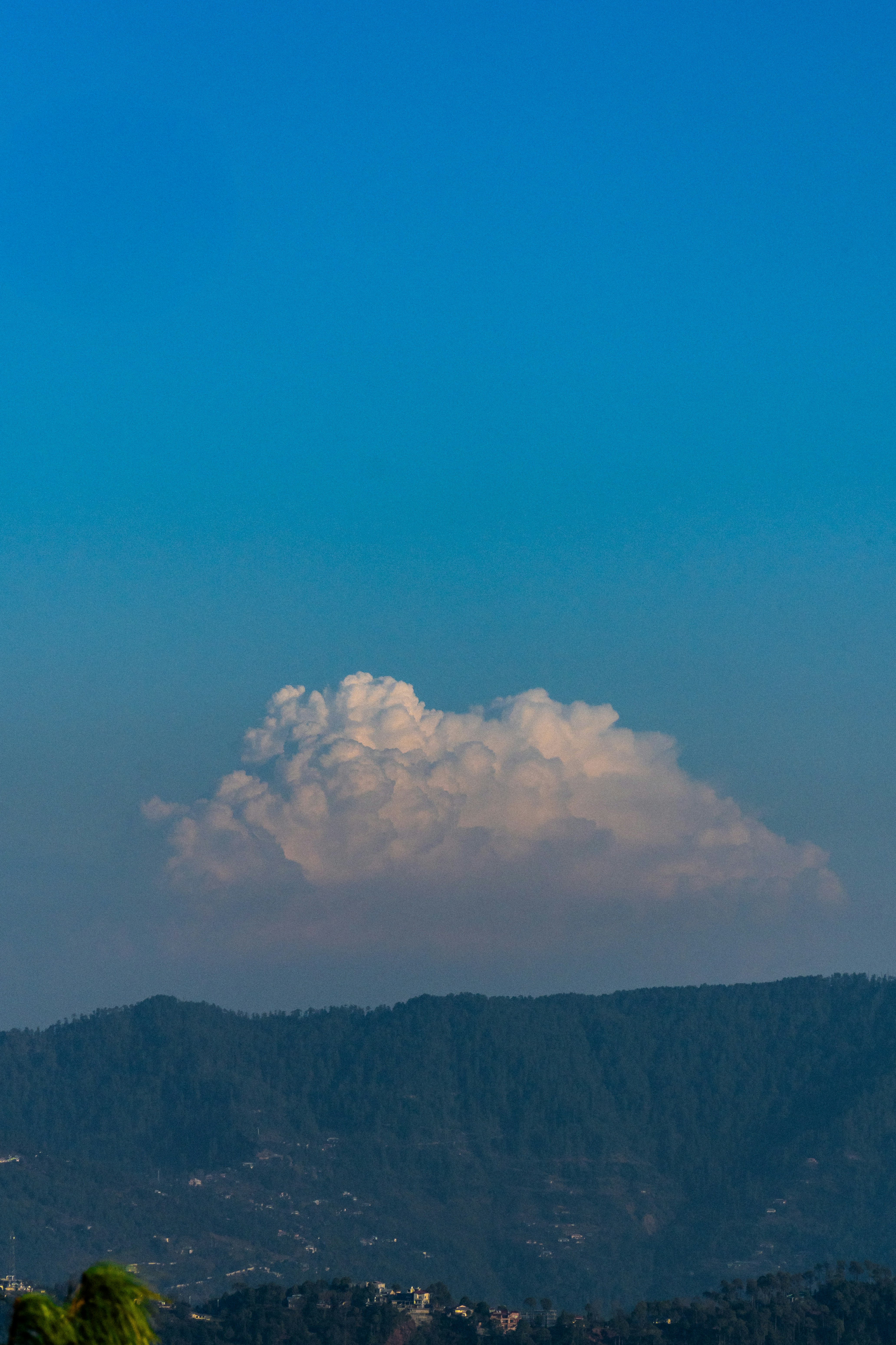 Cumulus Crown Over the Quiet Mountain Ridge
