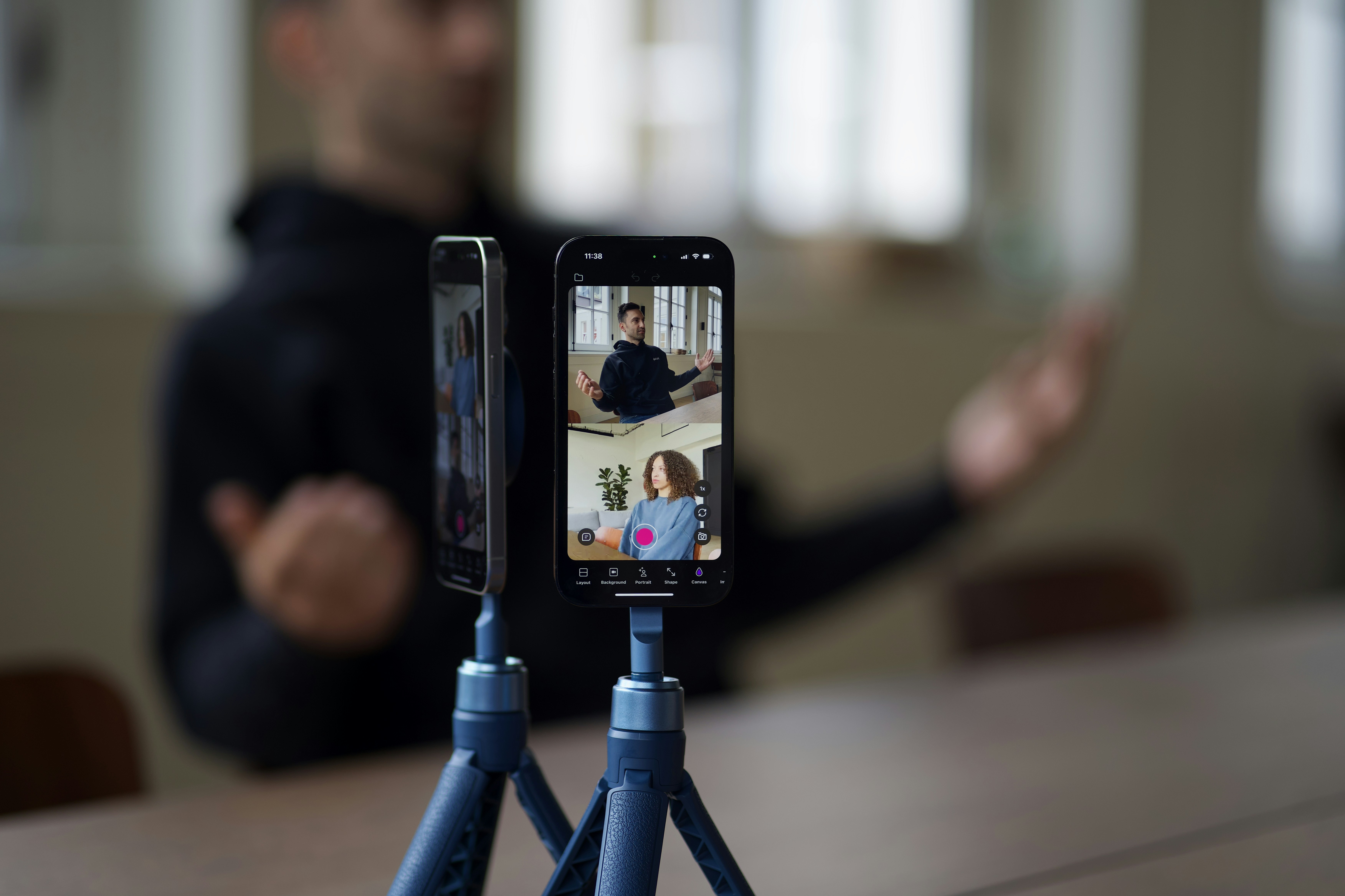 Twin Smartphone Tripods Frame a Quiet Studio Chat