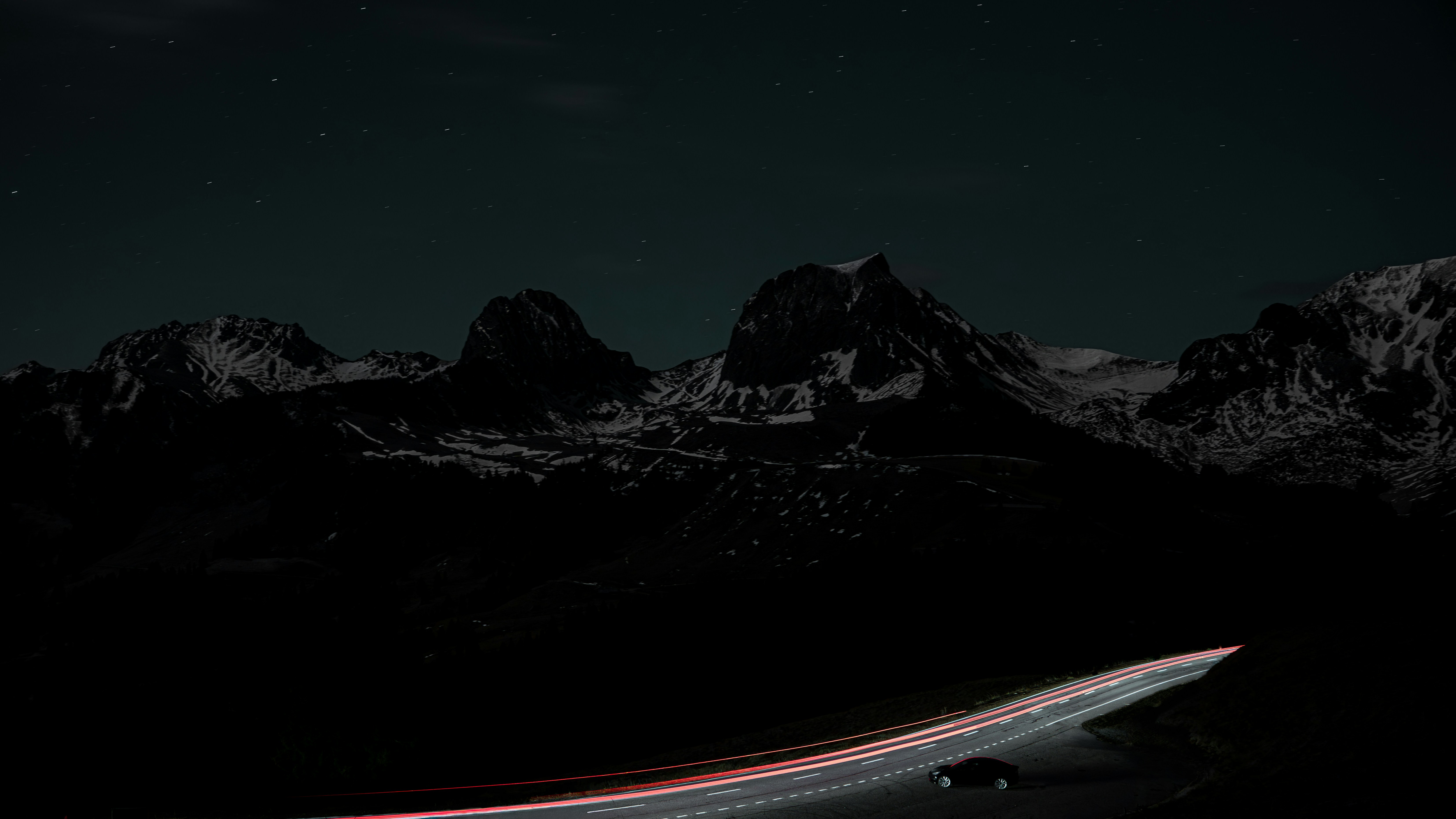 Midnight Winding: Red Light Trails Across the Alpine Night
