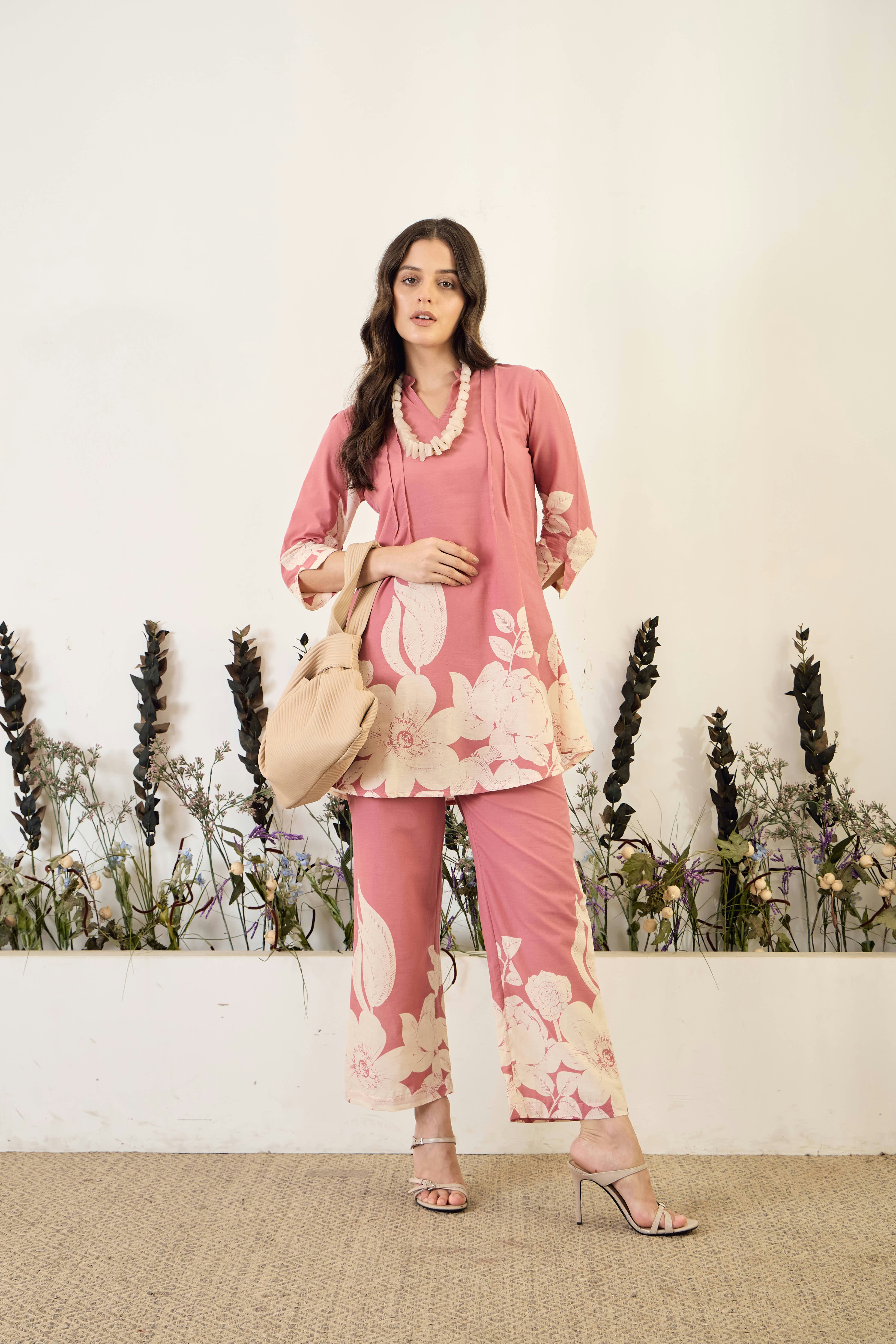 Petal-Pink Ensemble in a Minimal Studio with a Botanical Backdrop