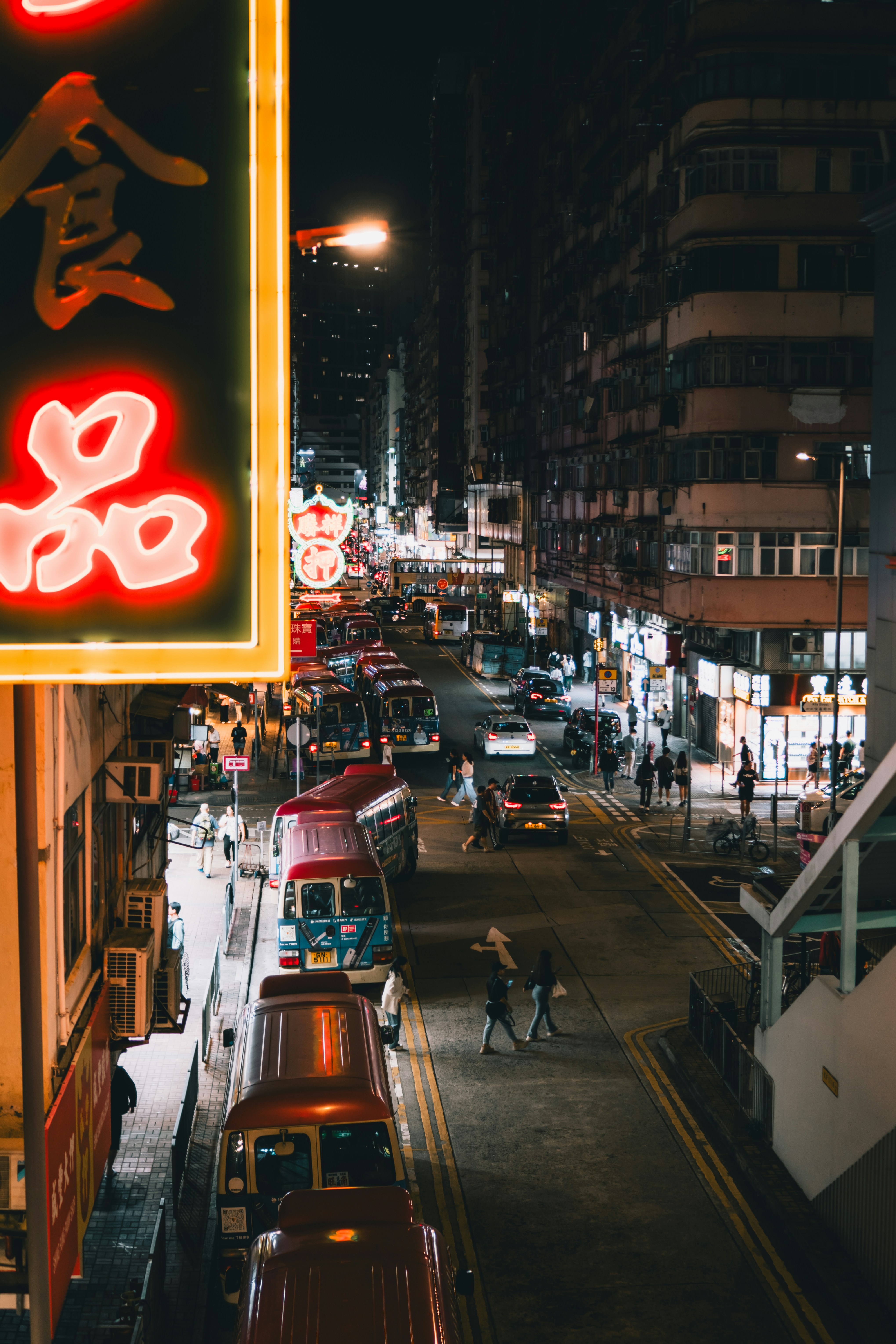 Neon signs illuminate a busy city street at night. photo – Free Urban ...