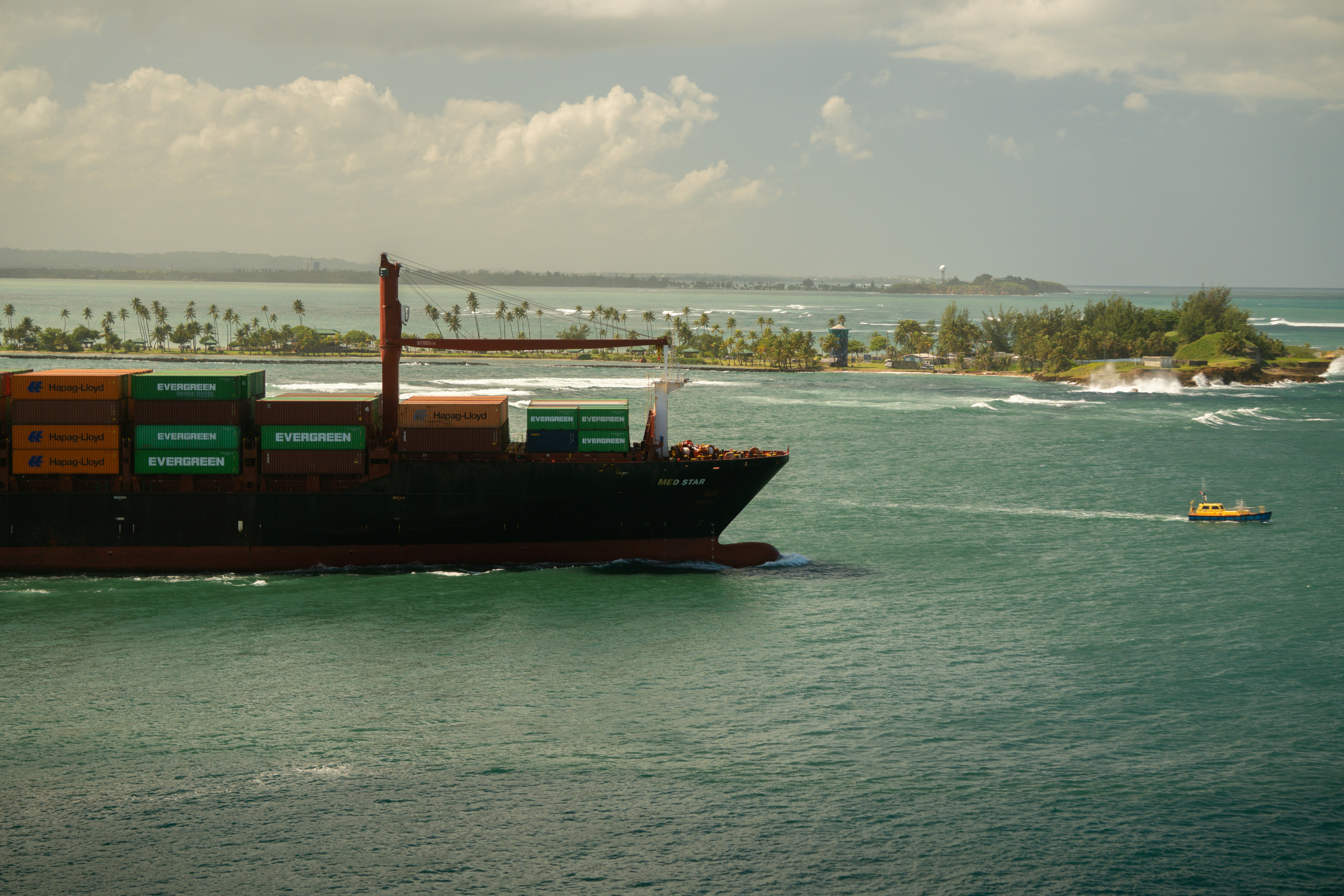 Green-Stacked Leviathan Crossing a Turquoise Sea