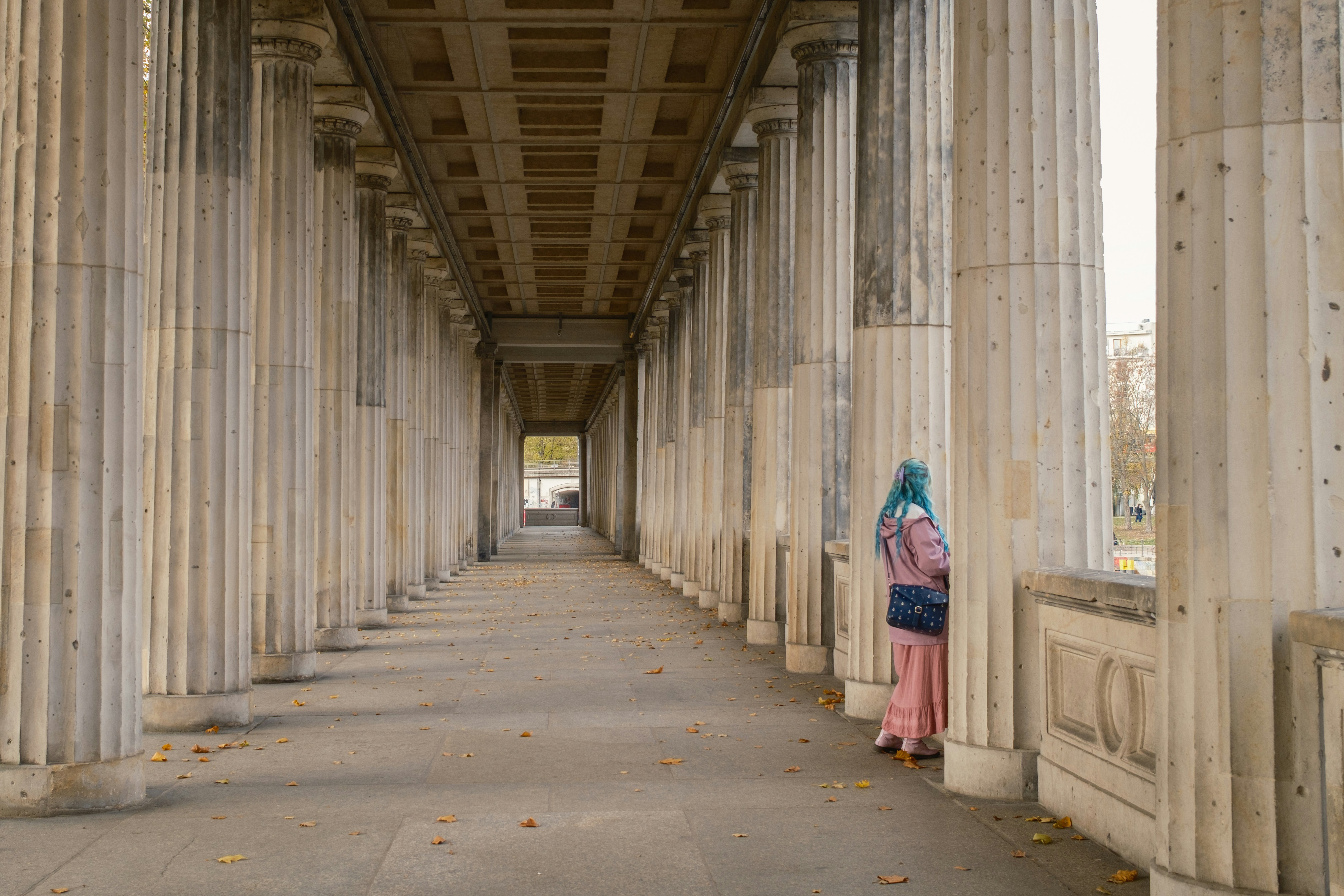 Azure-Tressed Voyager in a Sunlit Colonnade