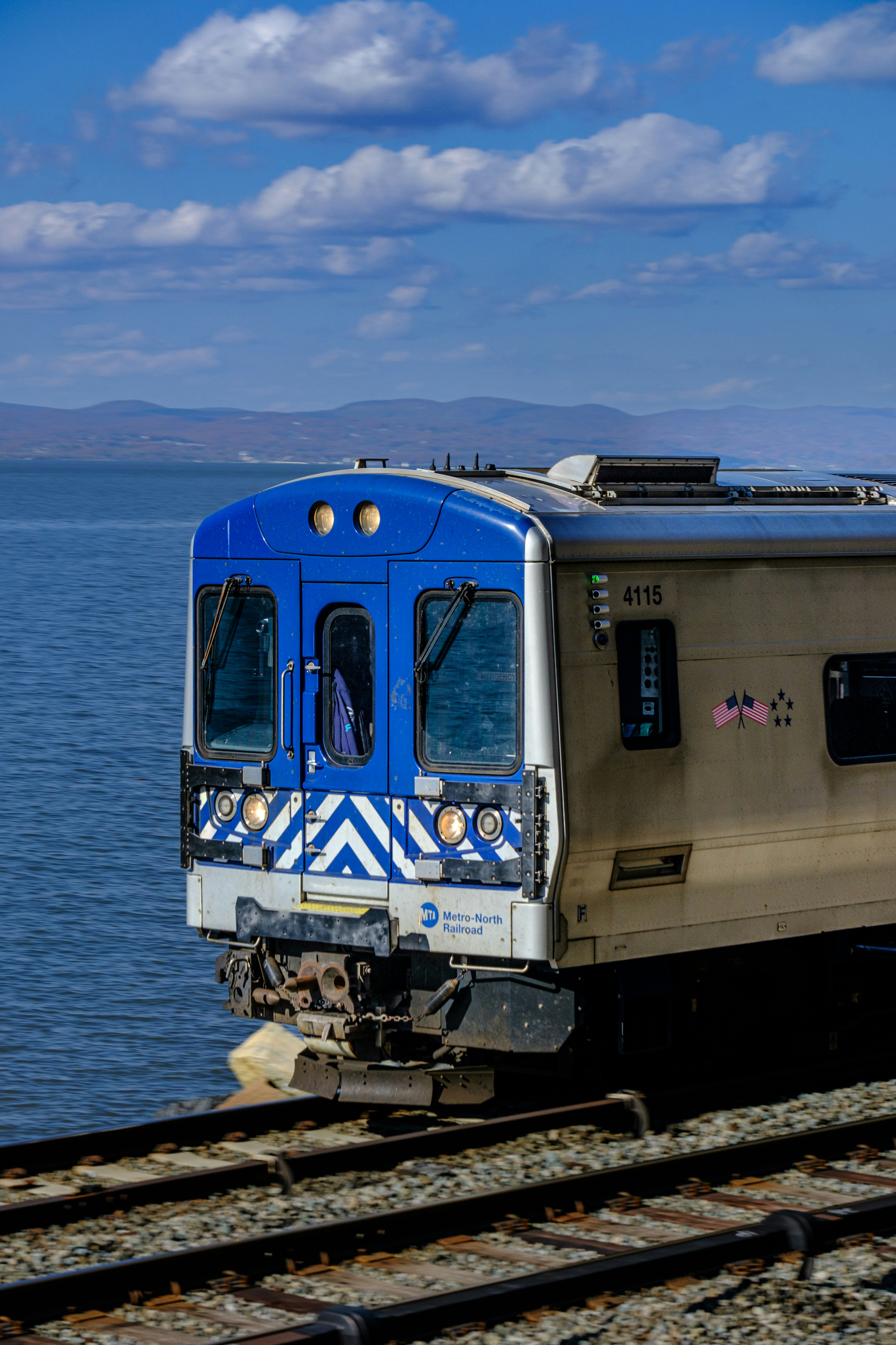 Azure Locomotive at the Lakefront: A Quiet Moment on Rails