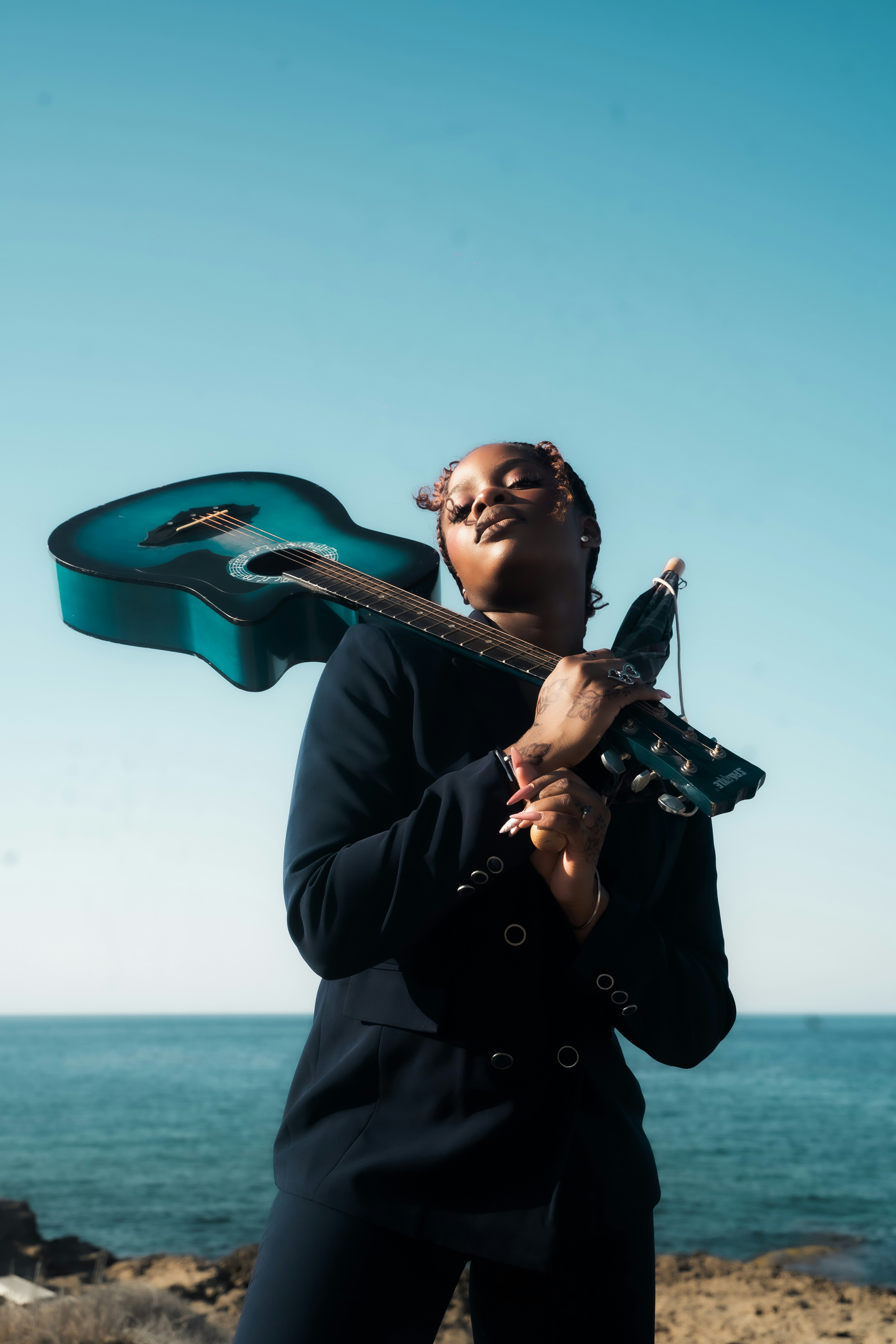 Teal-Gilded Guitar Serenade by the Sea