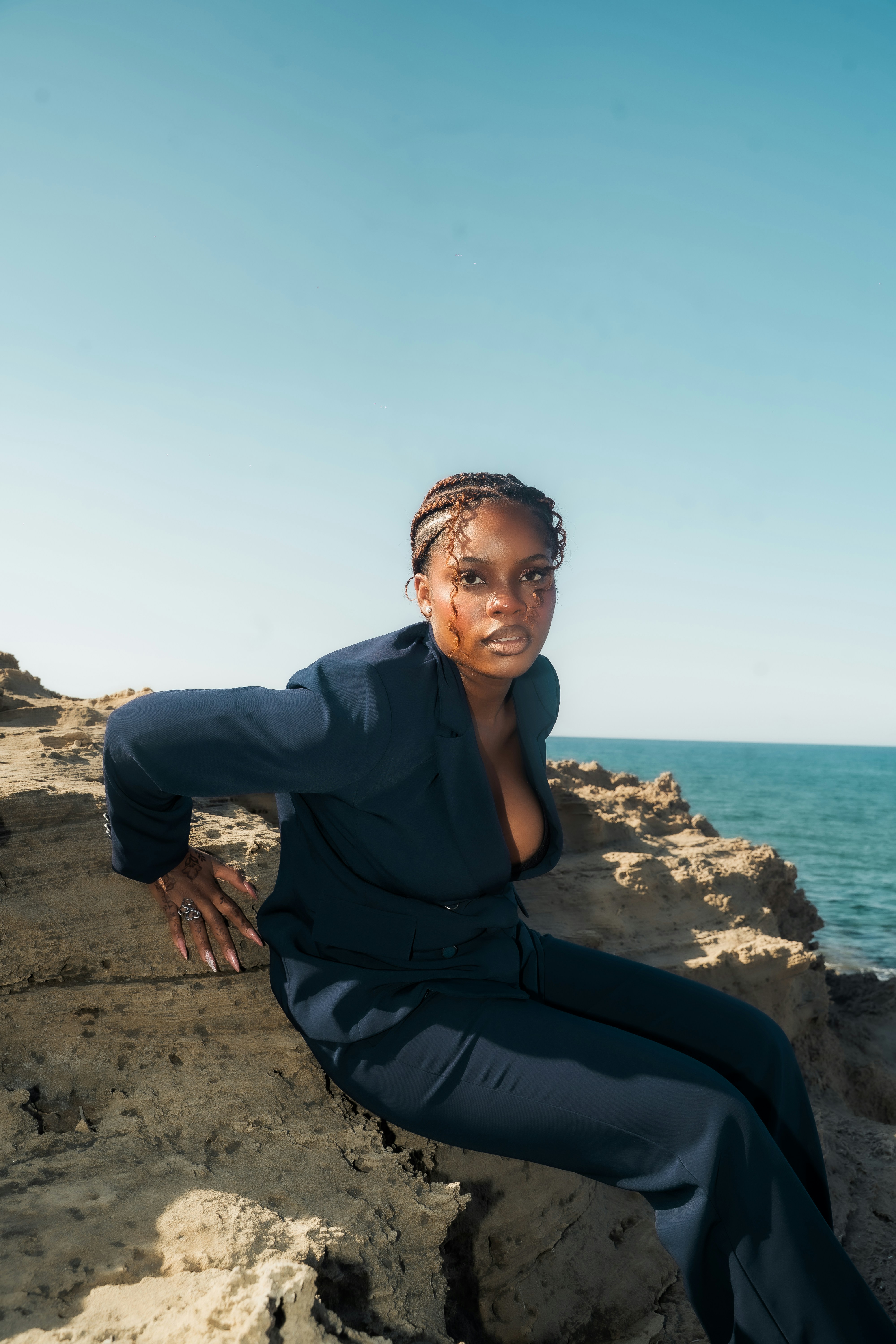 Navy Silence by the Sea: A Portrait on Weathered Cliffs