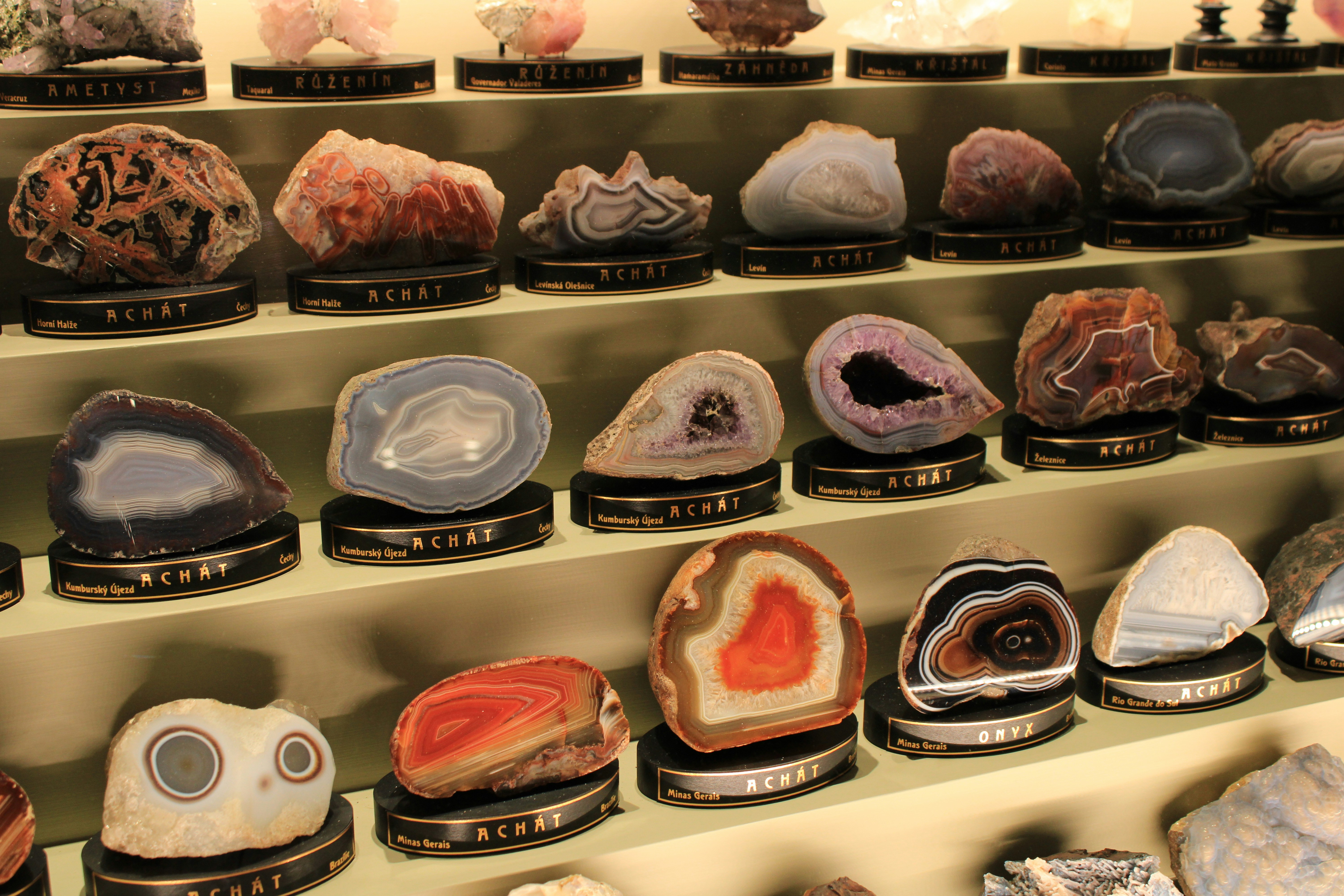 Crimson Core on Tiered Shelves: A Geode Gallery in Warm Light