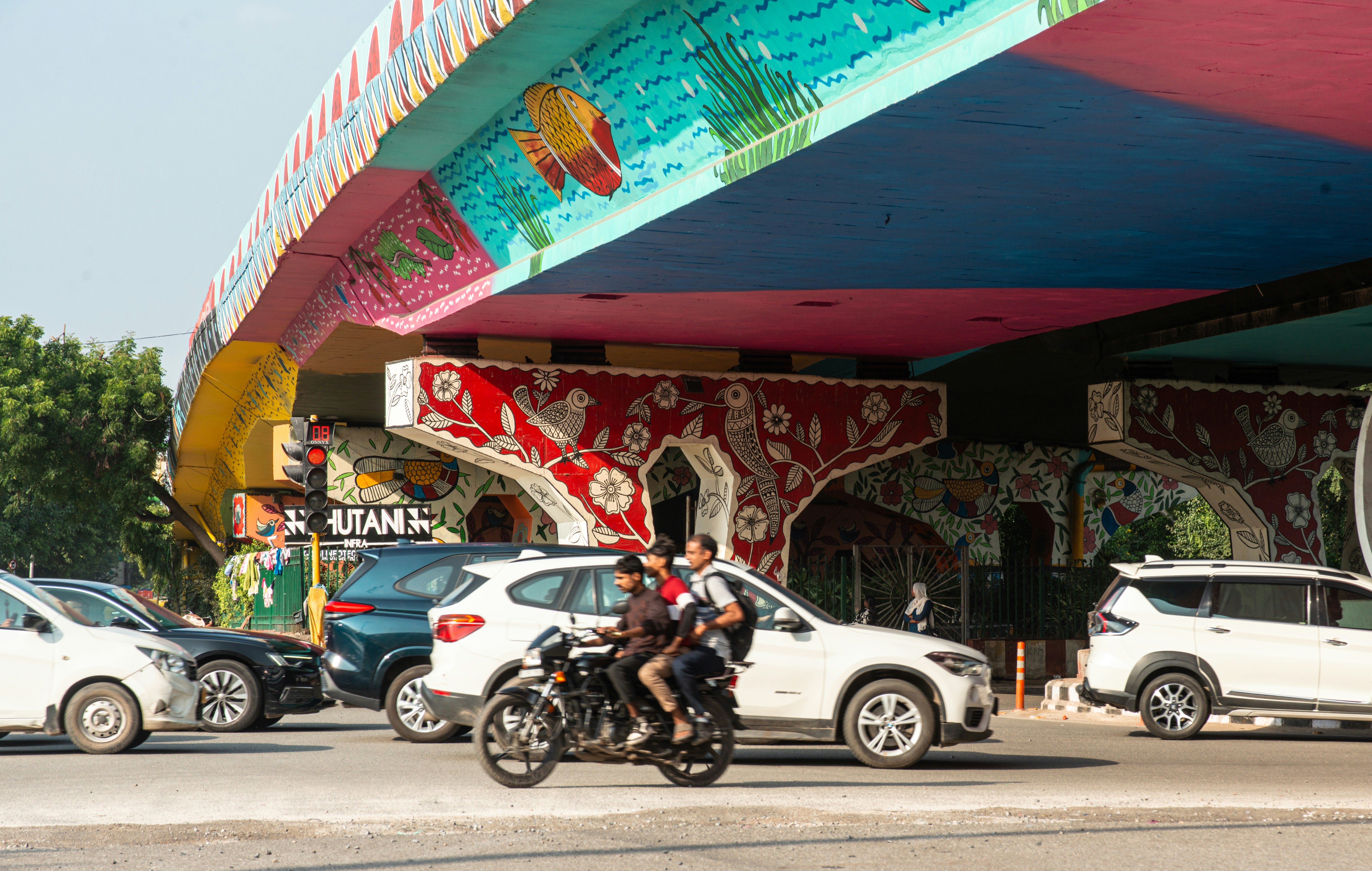Riders Under a Kaleidoscopic Overpass: Street Motion in Color