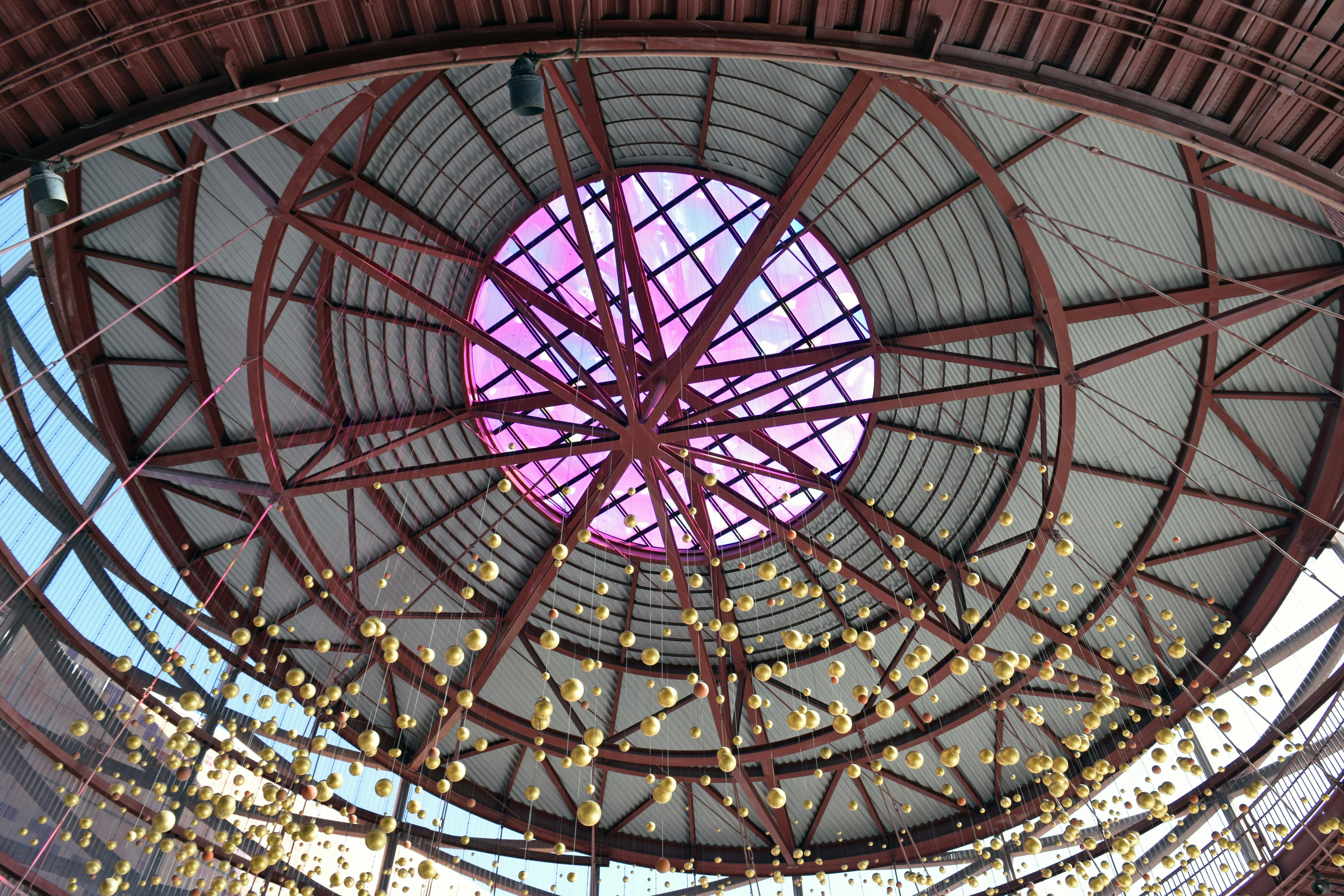 Purple Skylight Under a Lattice Dome: Rings of Light and Golden Orbs