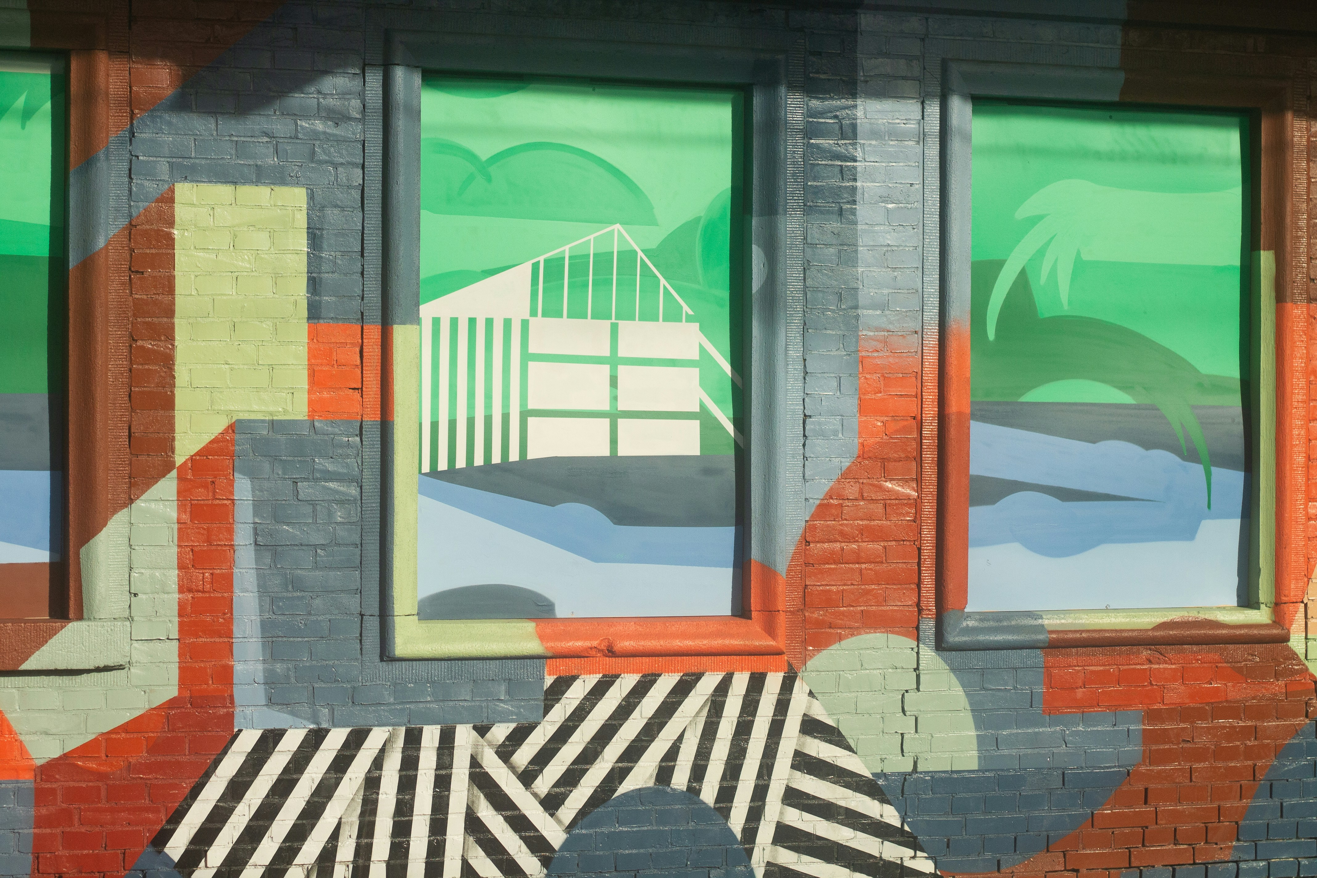 Tri-Panel Geometric Mural: A Cityscape Framed in Painted Windows