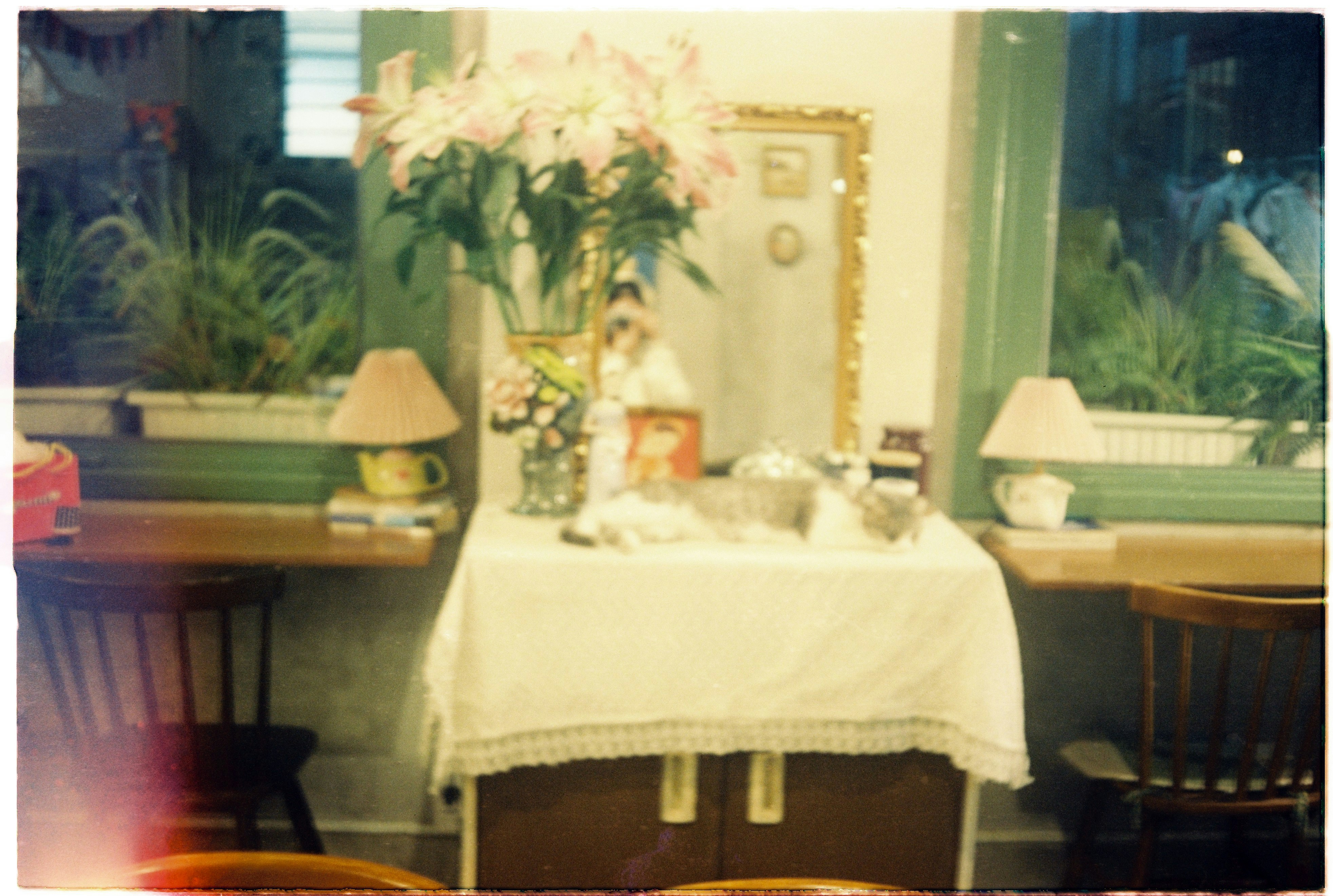 Bloom-Lit Shrine on a Lace-Cloth Table