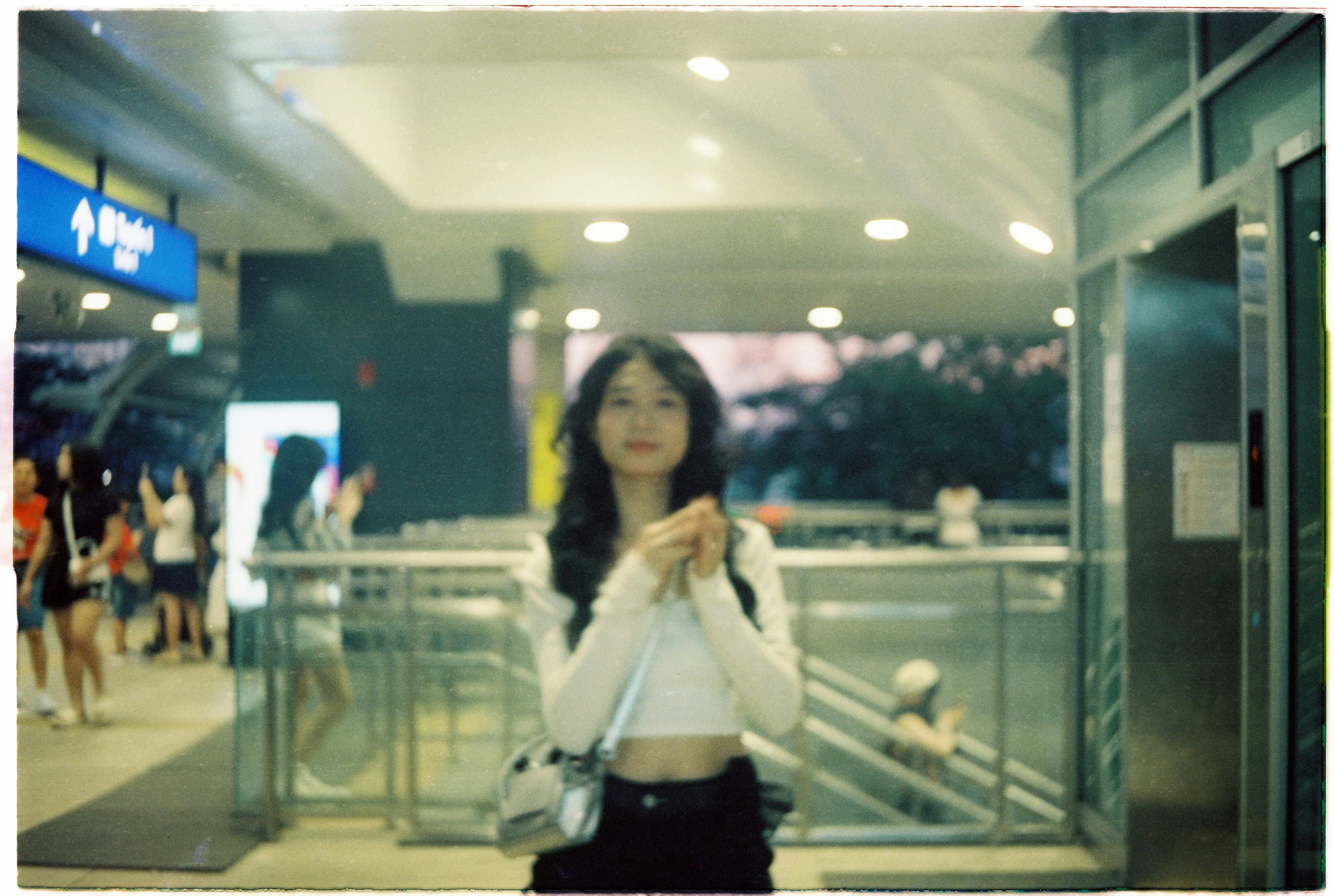 Soft-Focus Portrait in a Glass Atrium