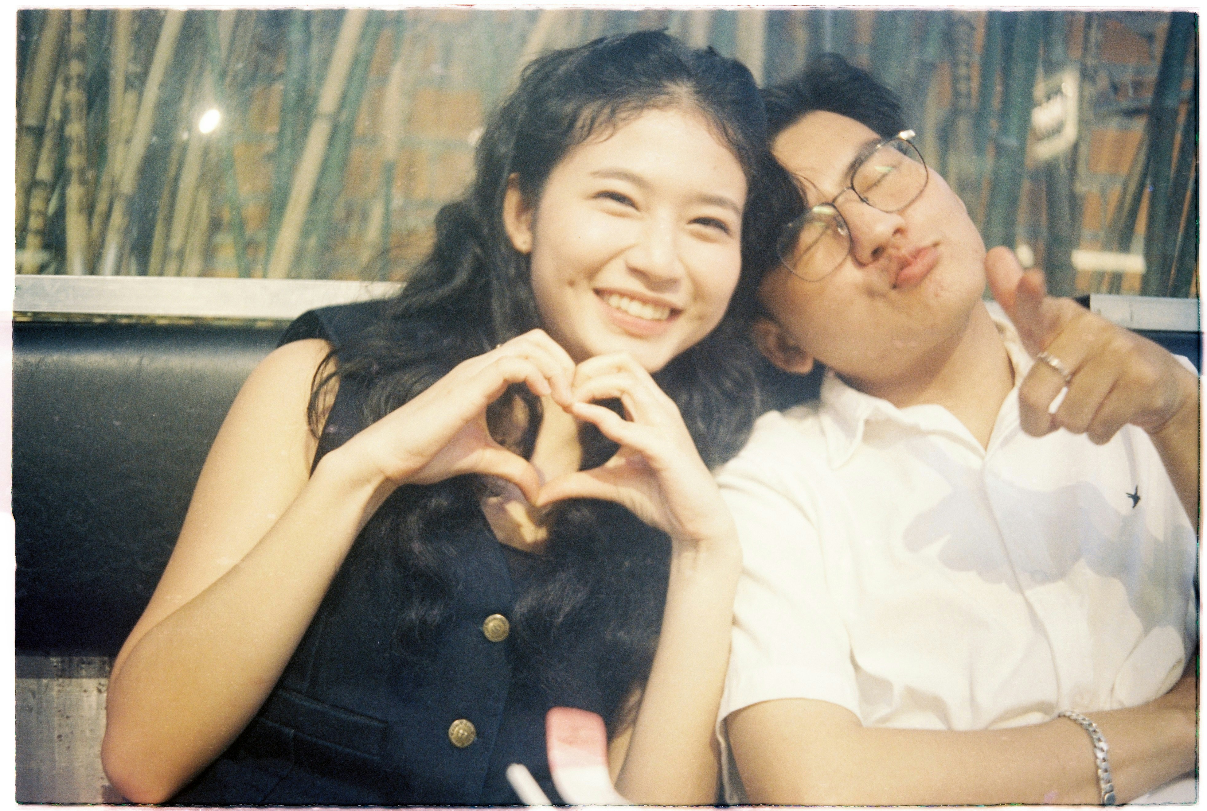 Heart Hands and Warm Smiles in a Retro Moment