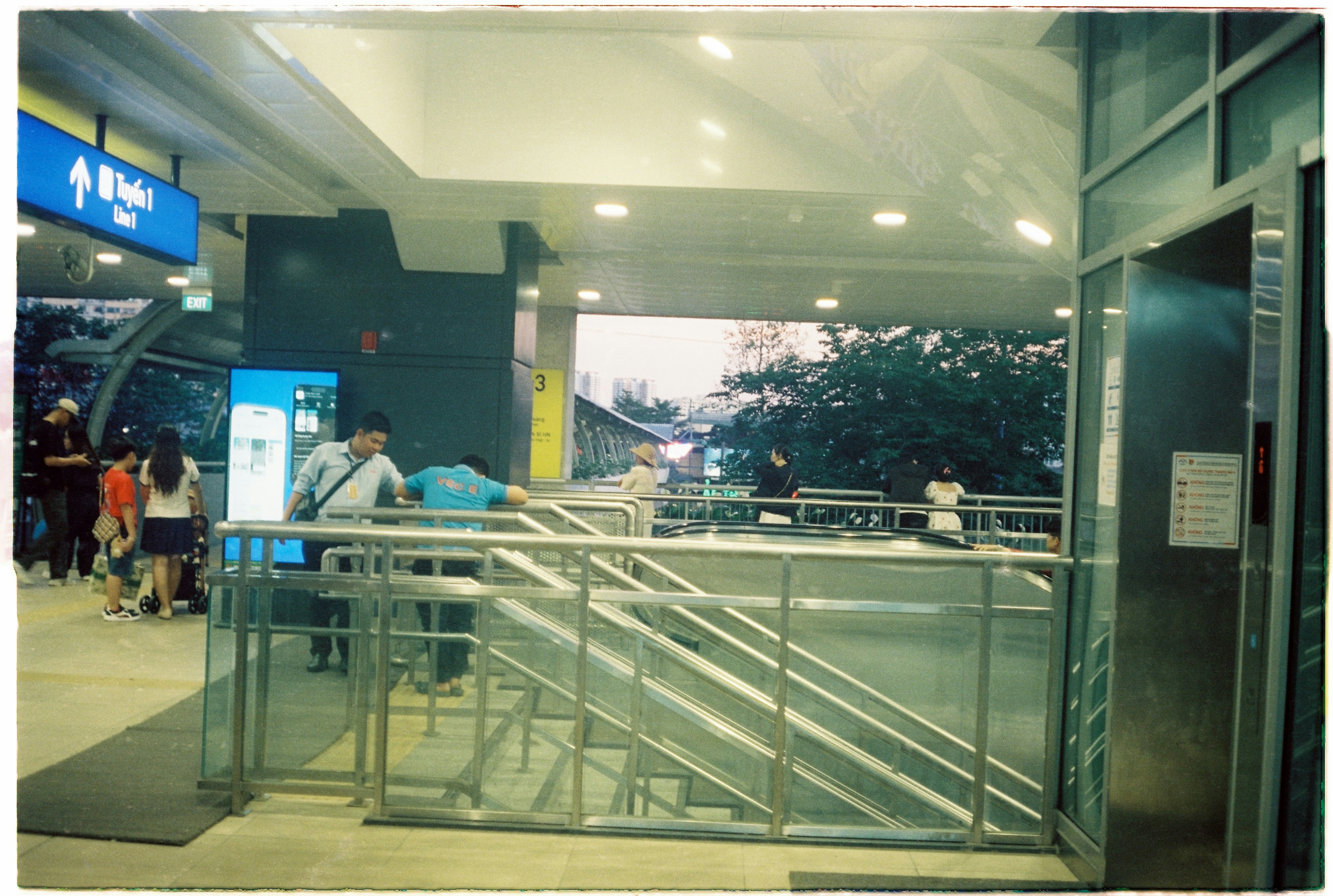 Threshold of Movement: Commuters at a Glass-Encased Station