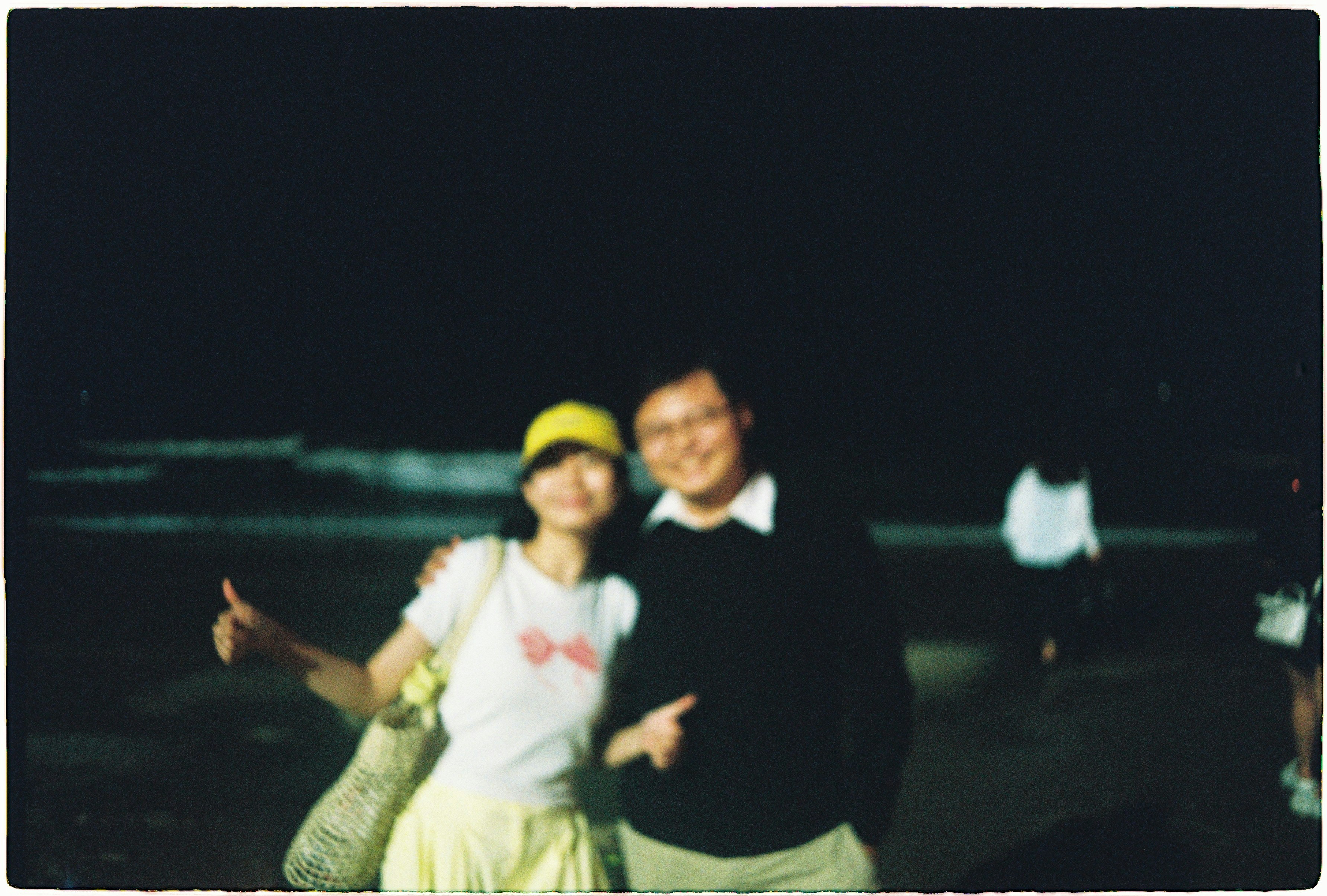 Night Beach Duo in Soft Blur: A Warm Moment by the Sea