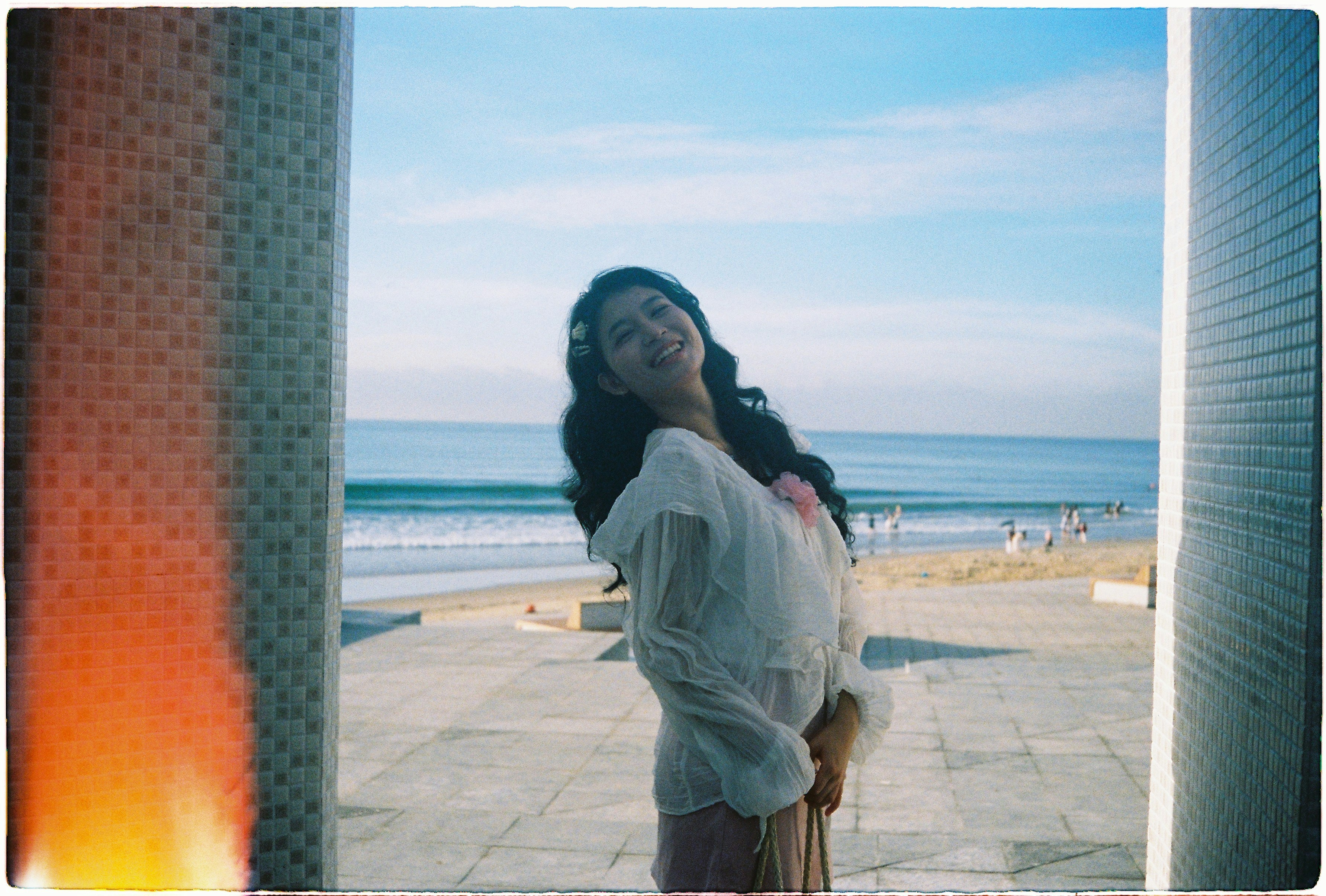 Seaside Portrait Framed by Coastal Columns