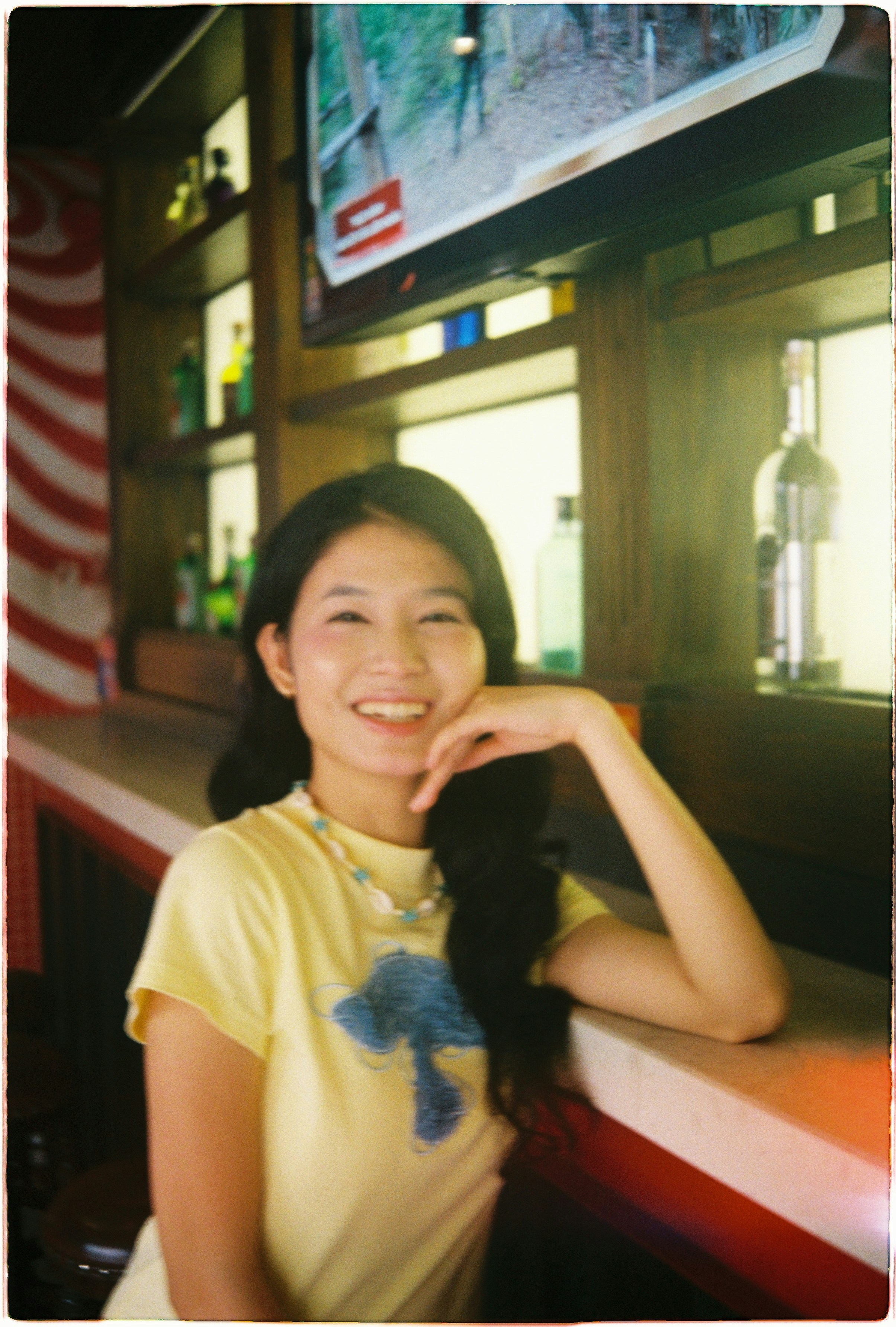 Bar-side Glow: A Quiet Smile in Warm Light