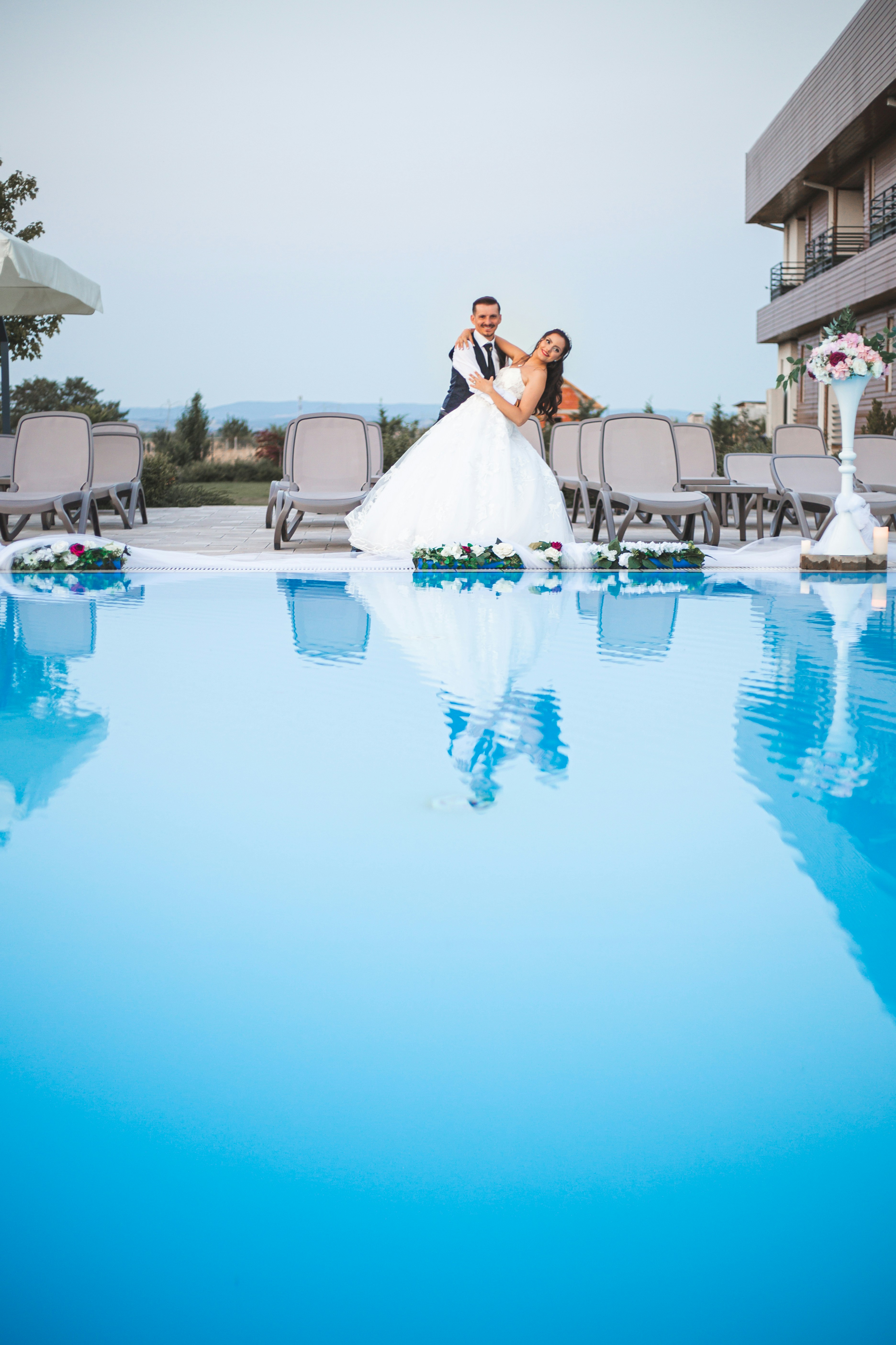 Poolside Vows: A Reflected Moment by Blue Tranquility