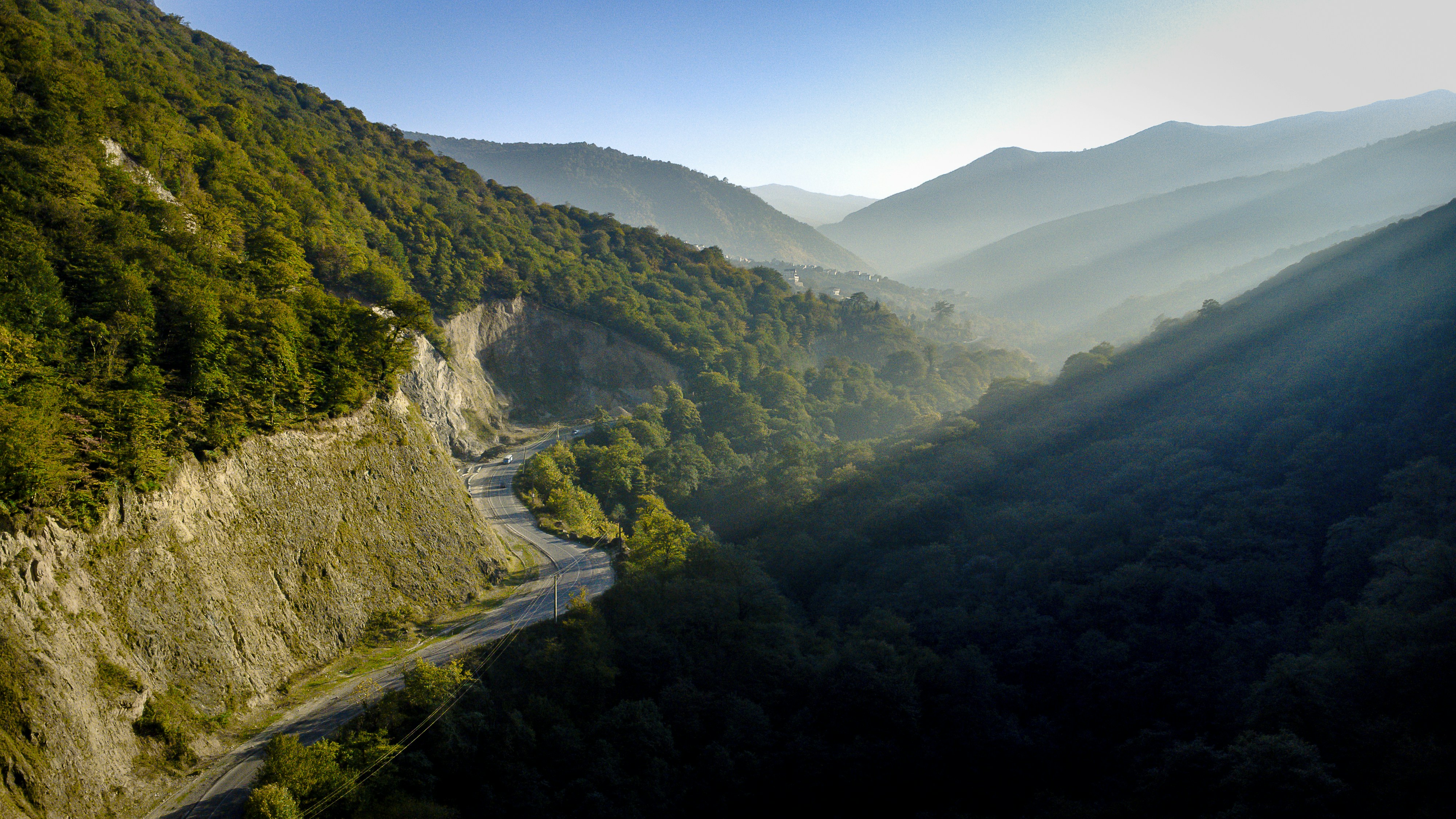 Two souls breathing in the morning mist, lost in the silence of the mountains