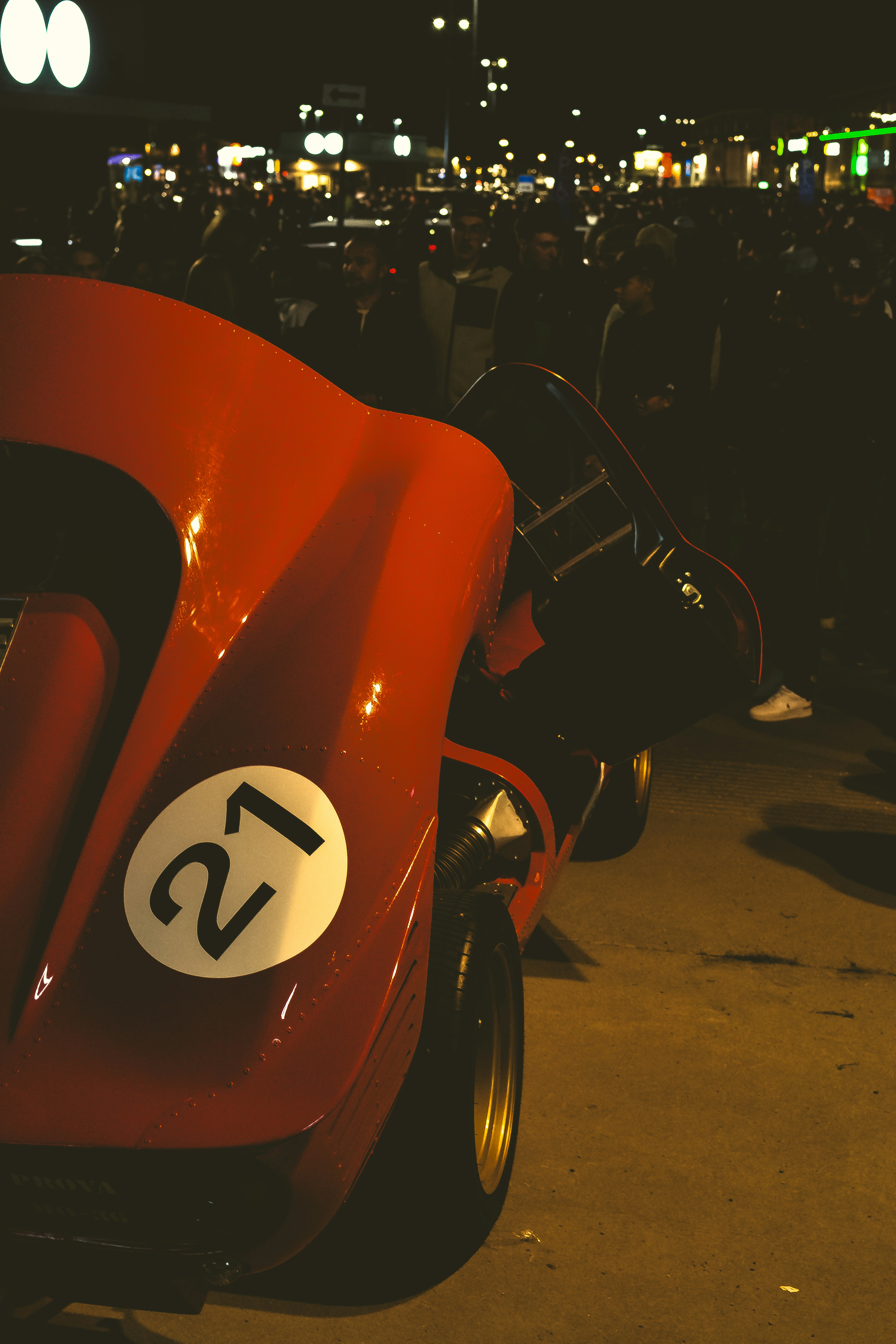 Crimson Arrow at Night, Framed by City Lights