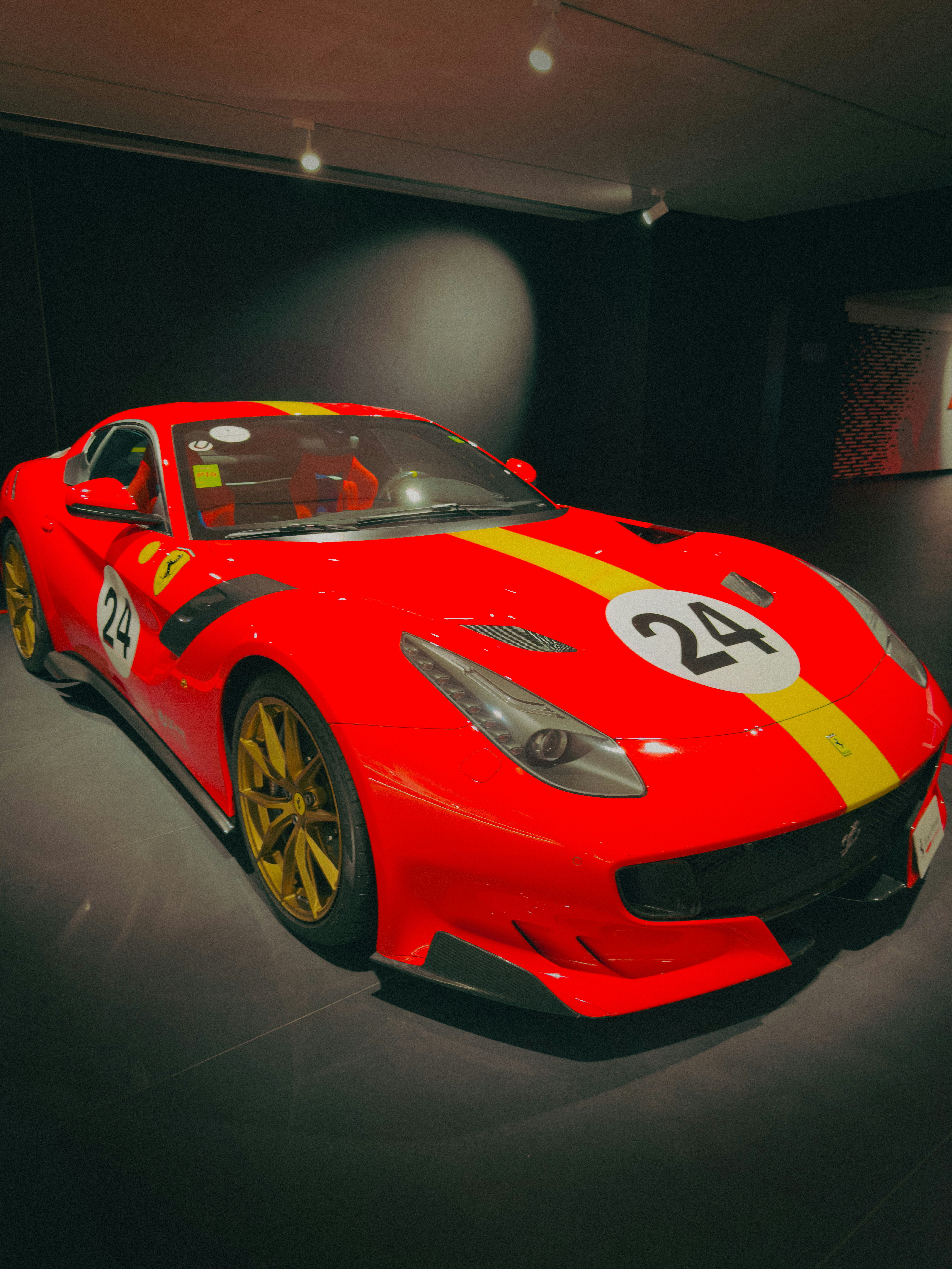 Scarlet Thunder in a Velvet Showroom: Ferrari 24 Race Car Masterpiece