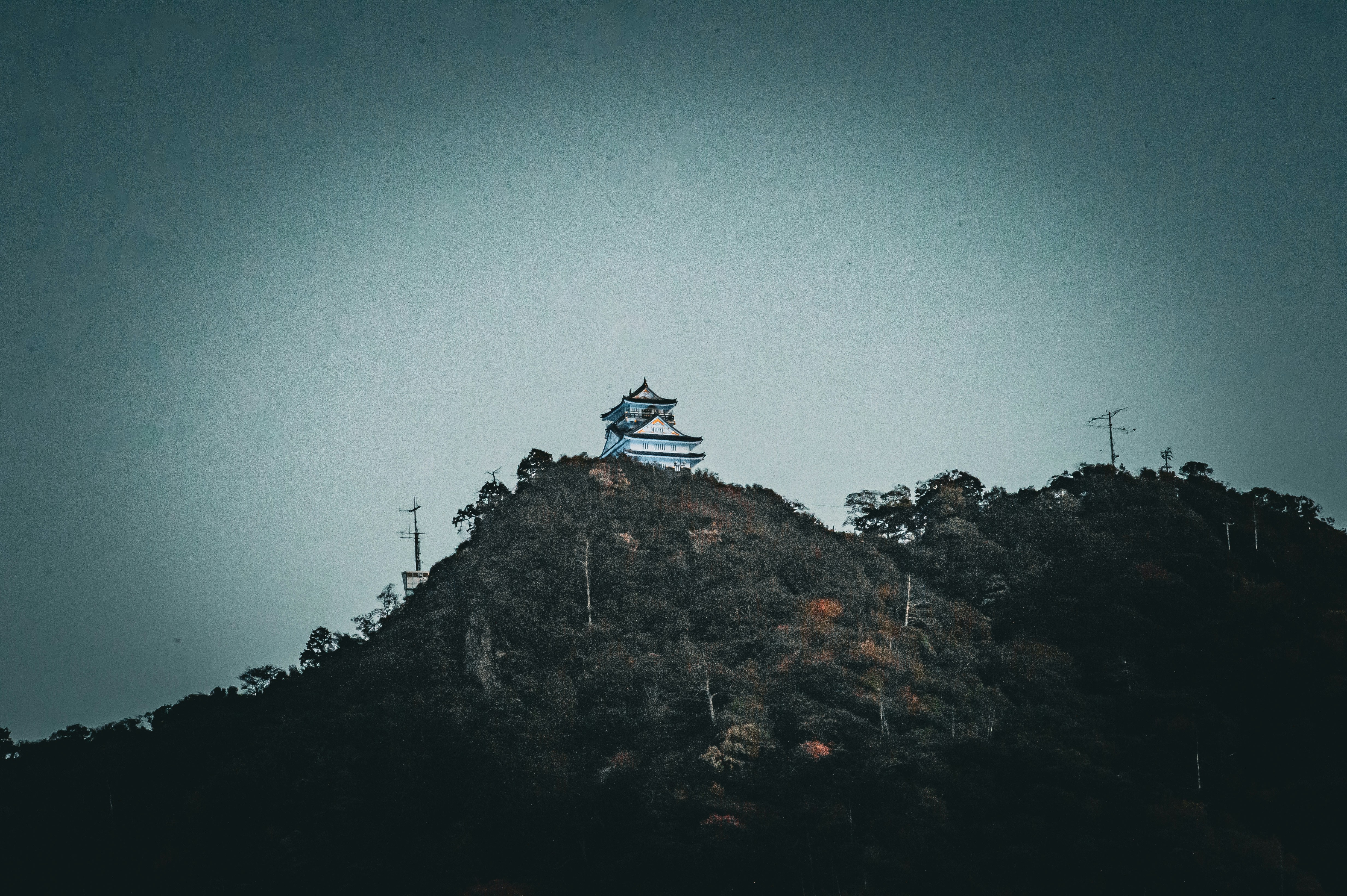 Crested Pagoda: A Quiet Shrine on a Shadowed Hill