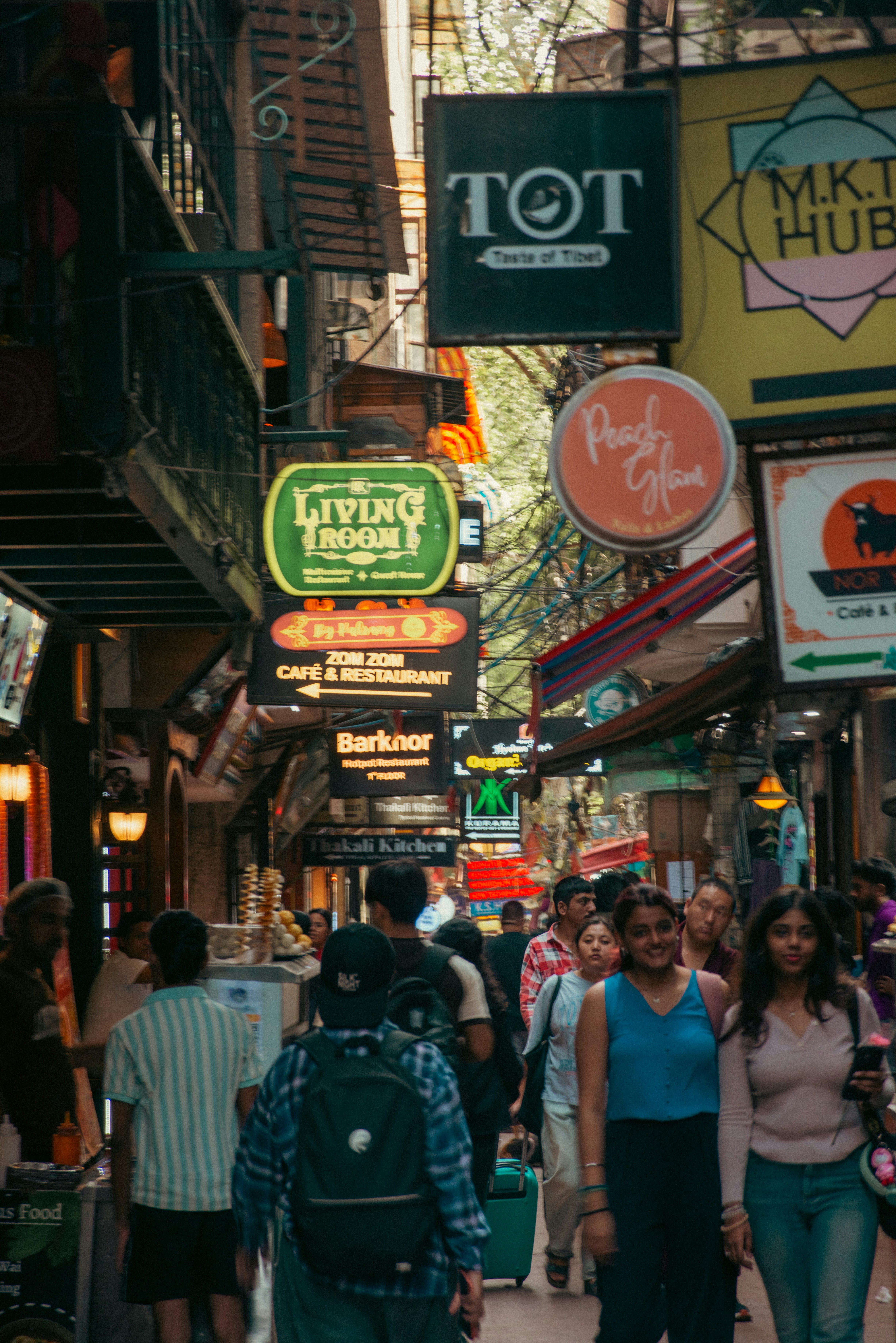 Signlit Alley: Neon Signs and a Pulse of Pedestrians