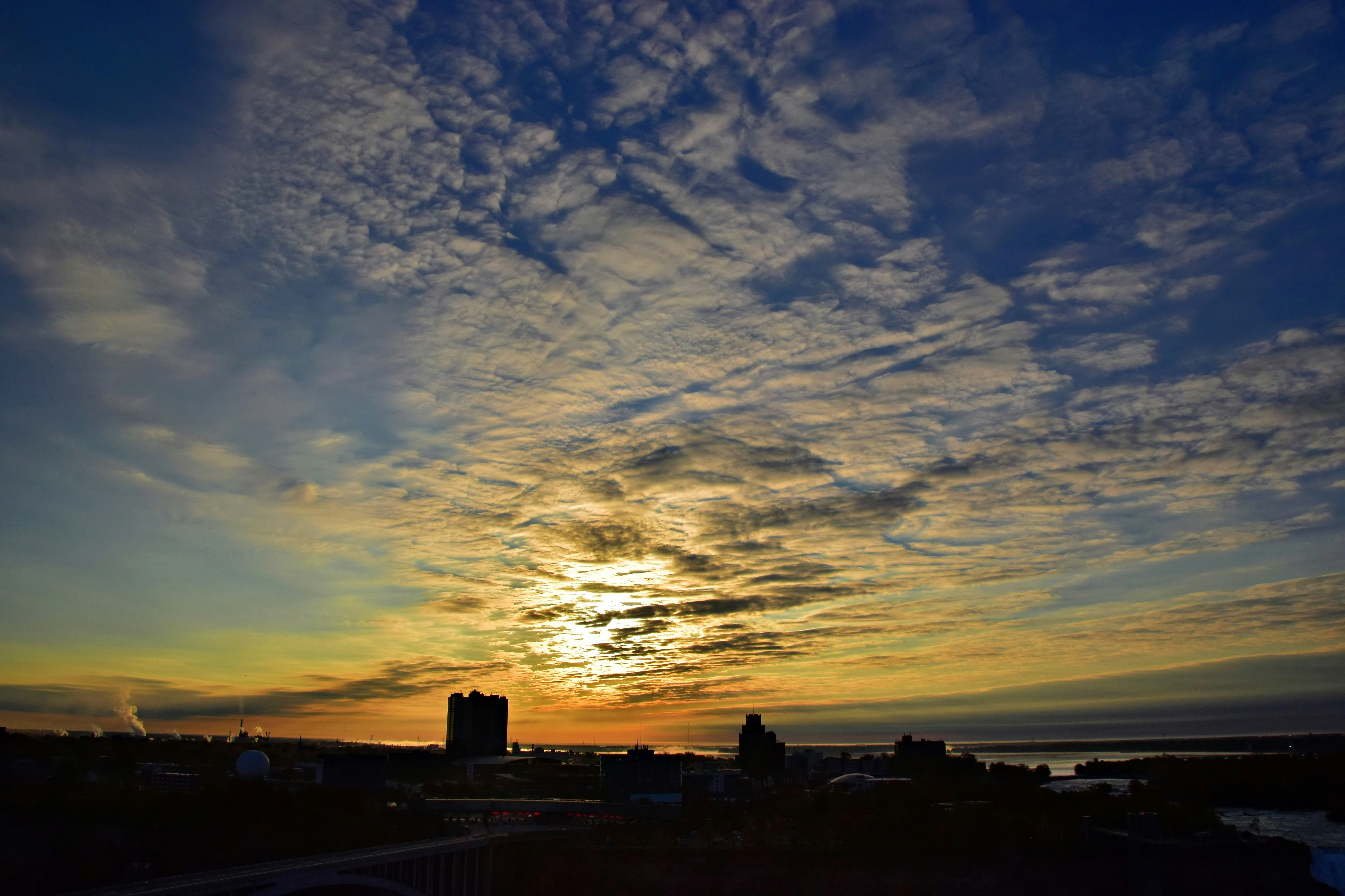 Sunfall Over a Silhouetted Coastal City