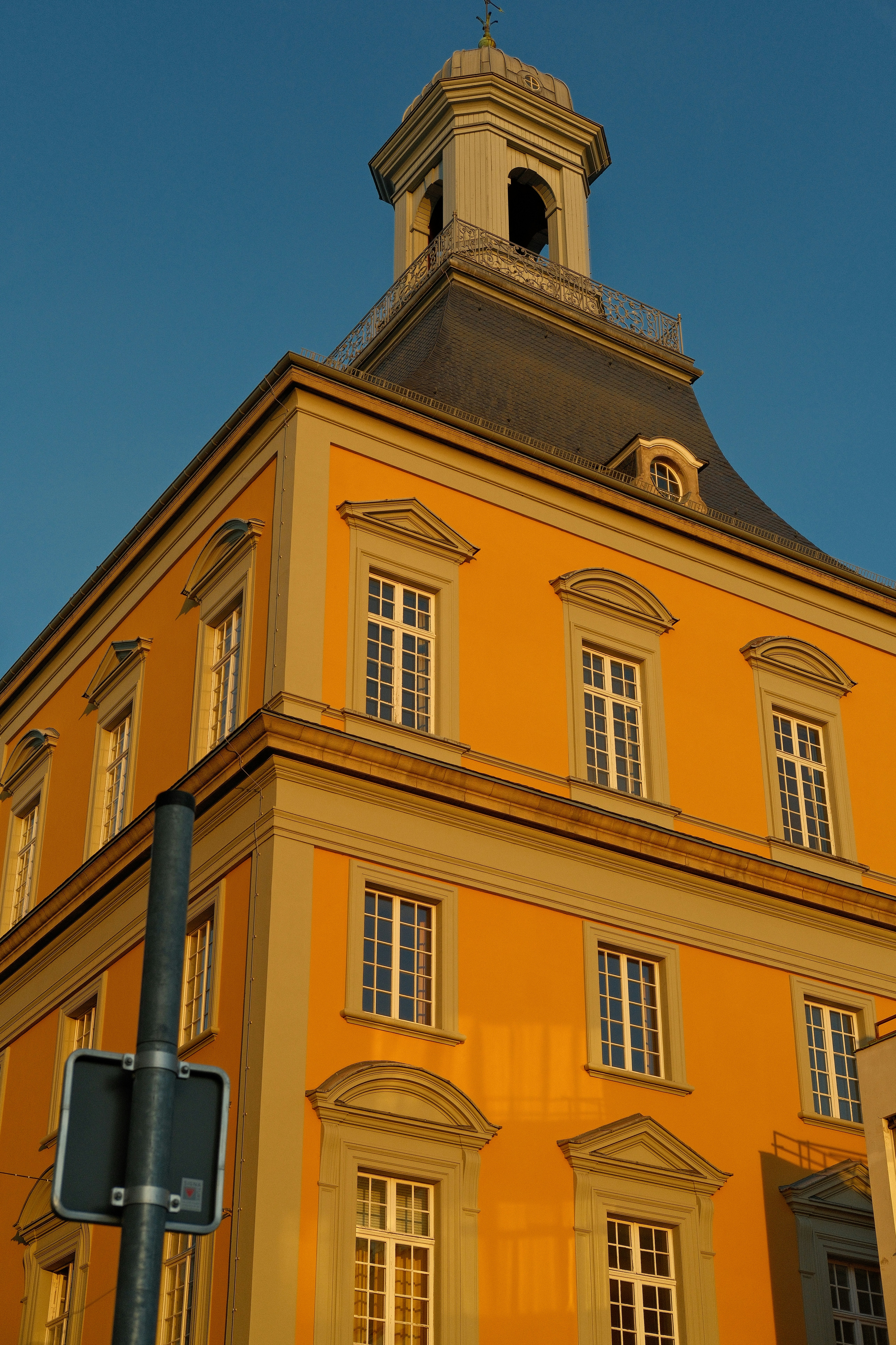 Cupola Crowned in Sun: A Yellow Facade Reaching for the Sky