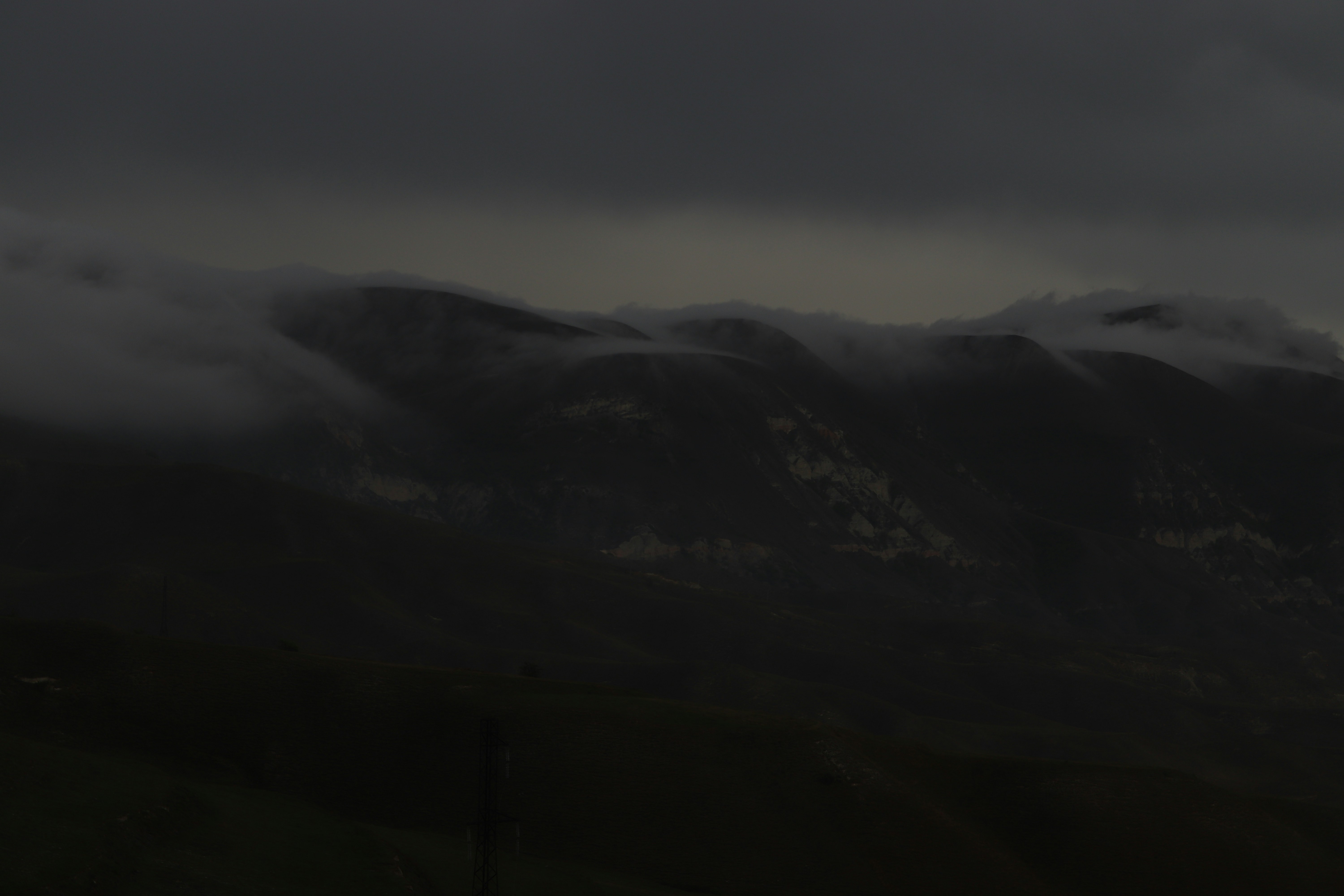 Dusk Over the Alpine Crest: A Ridge Wreathed in Evening Mist