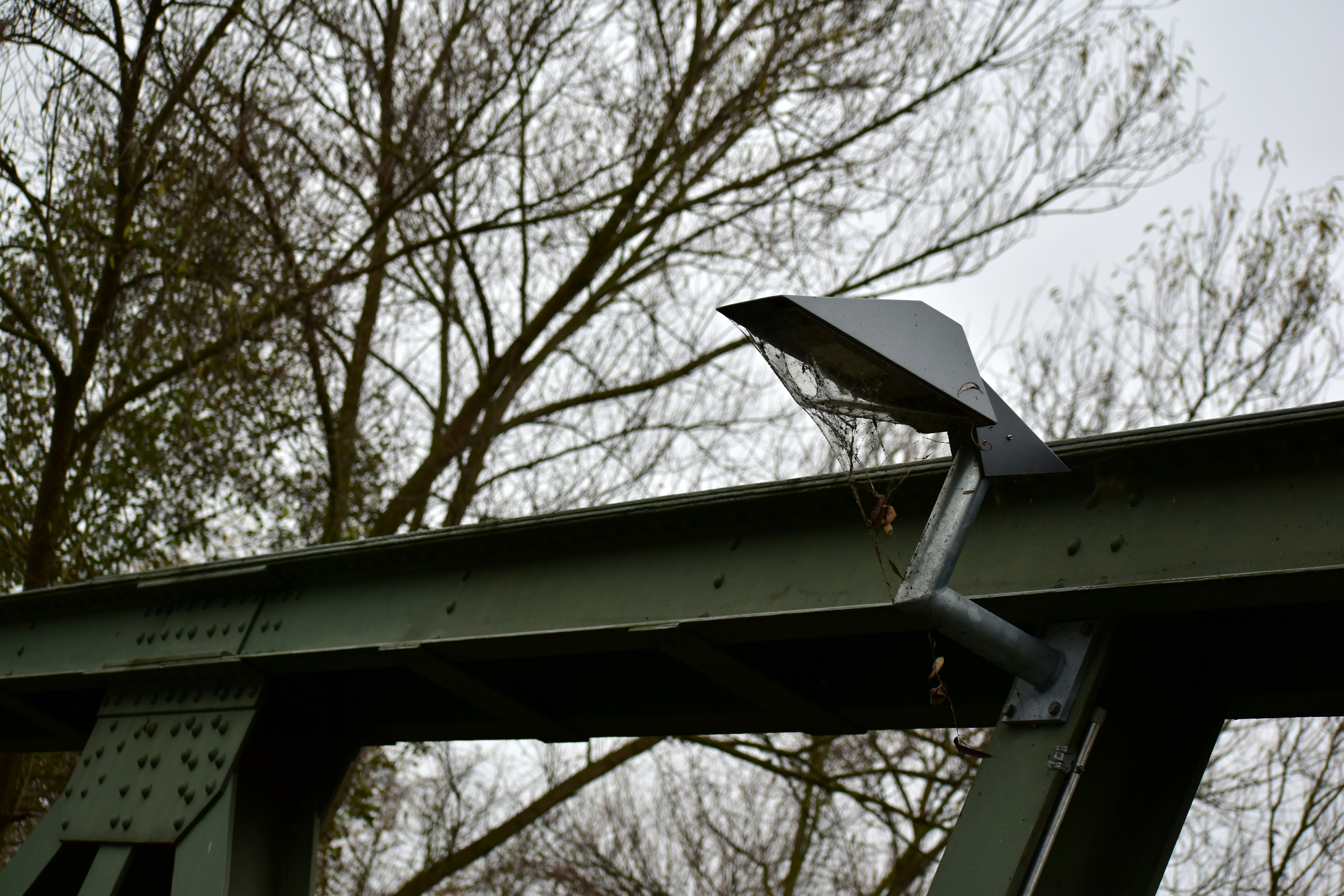 The lamp illuminates the bridge railing (Germany - industrial)
