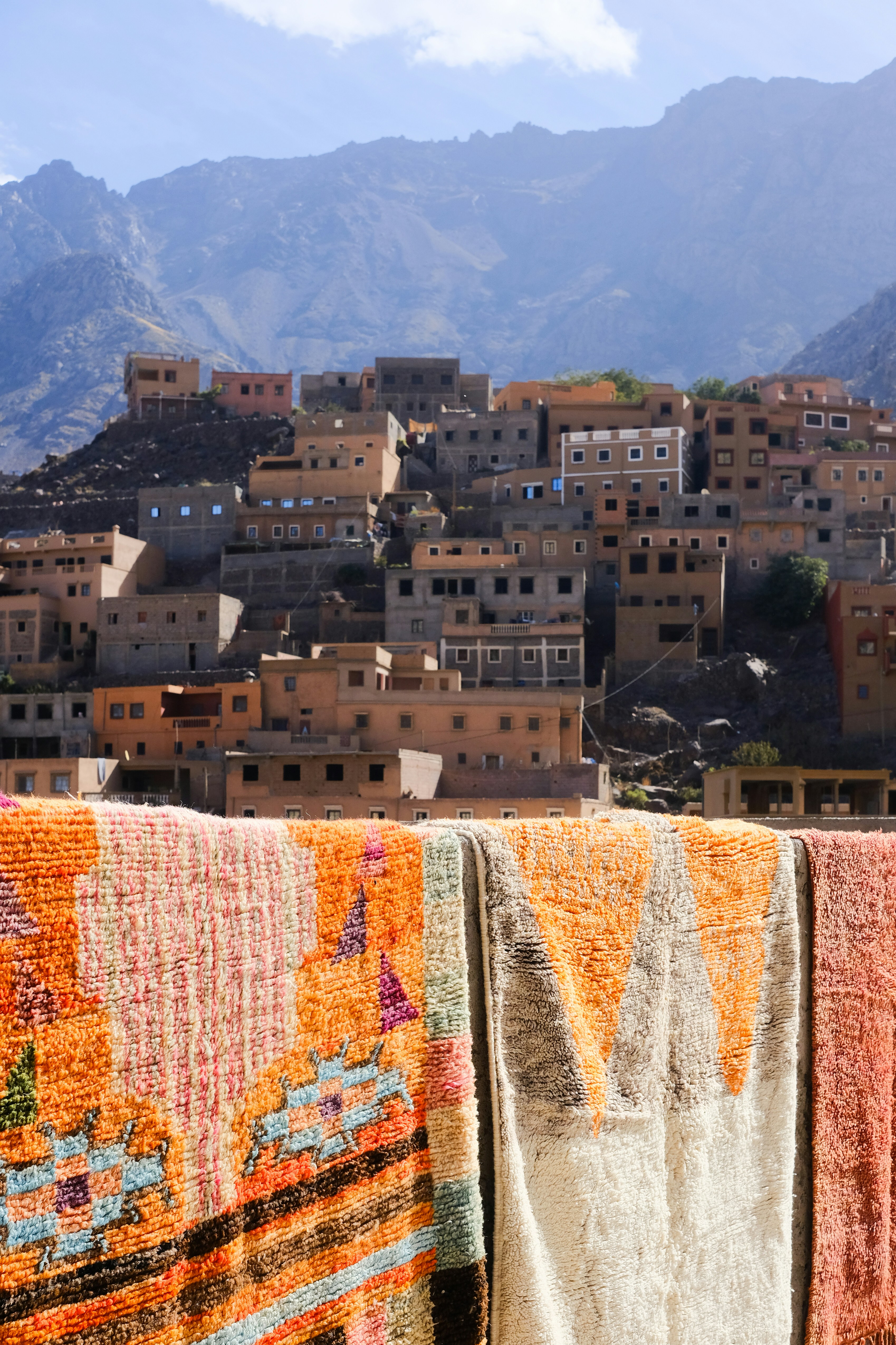 Terracotta Village Terraces Framed by Colorful Weaves