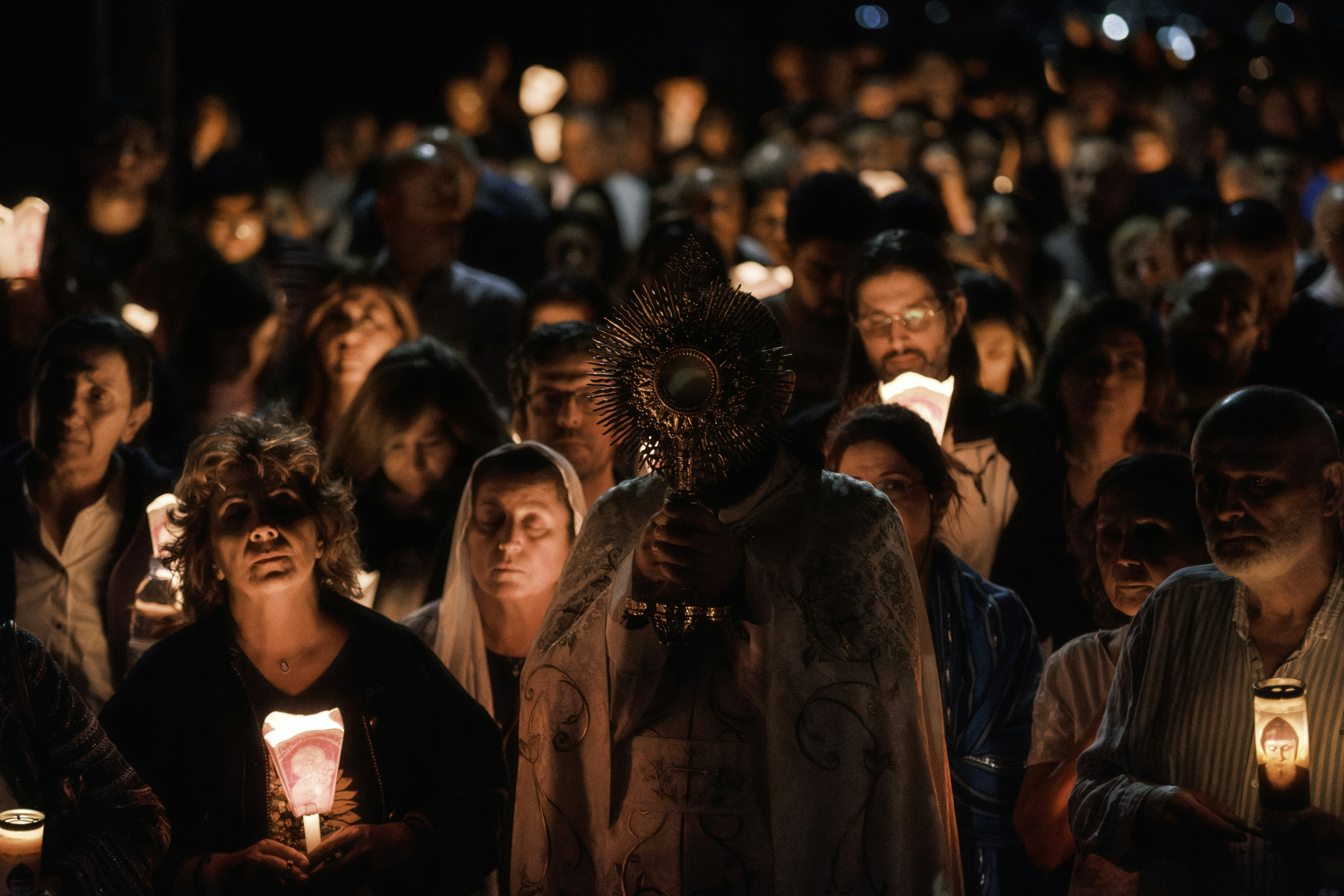 Candlelit Crown: A Sunflower Halo Among the Crowd