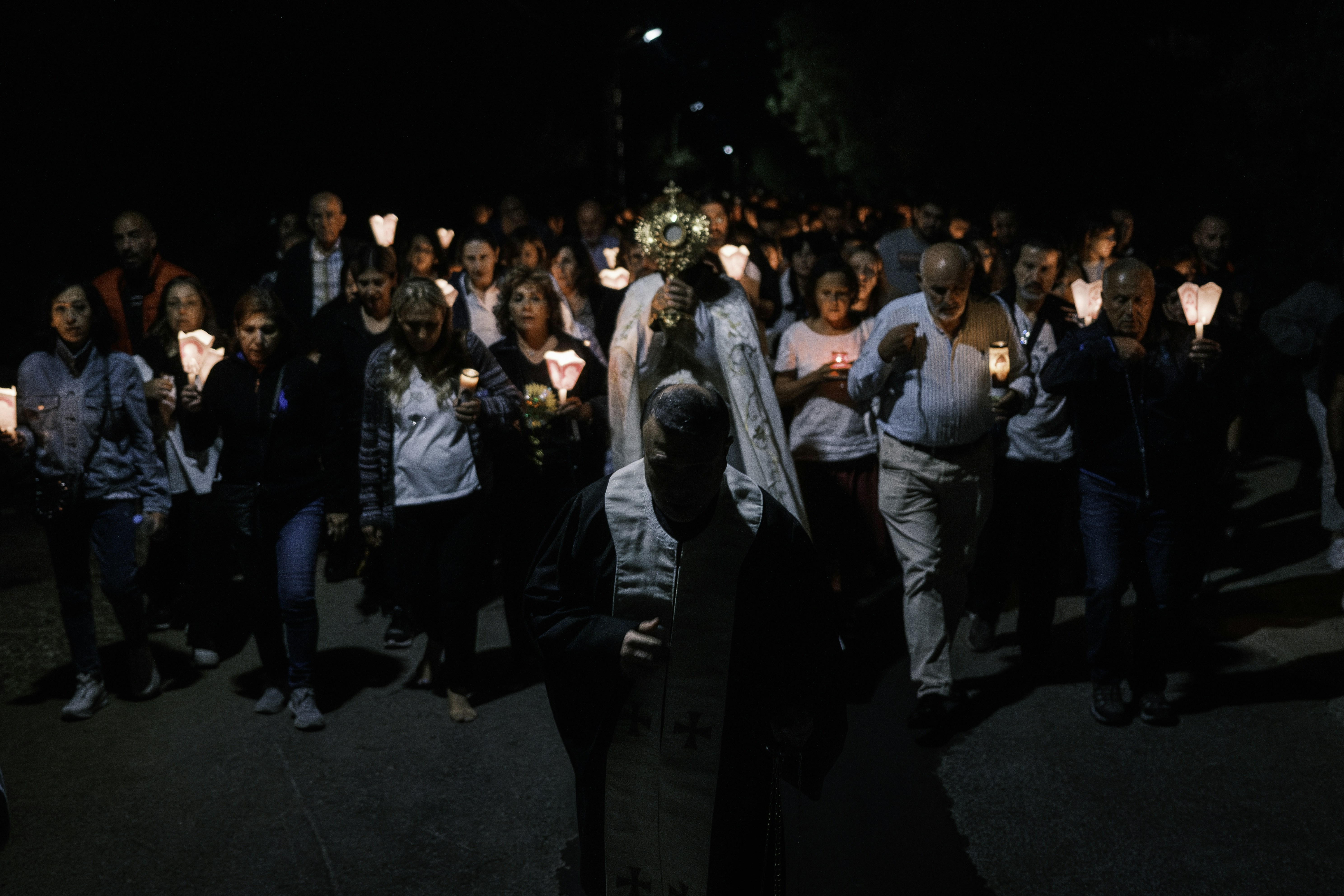 Candlelit March: The Cleric at the Heart of a Night Vigil