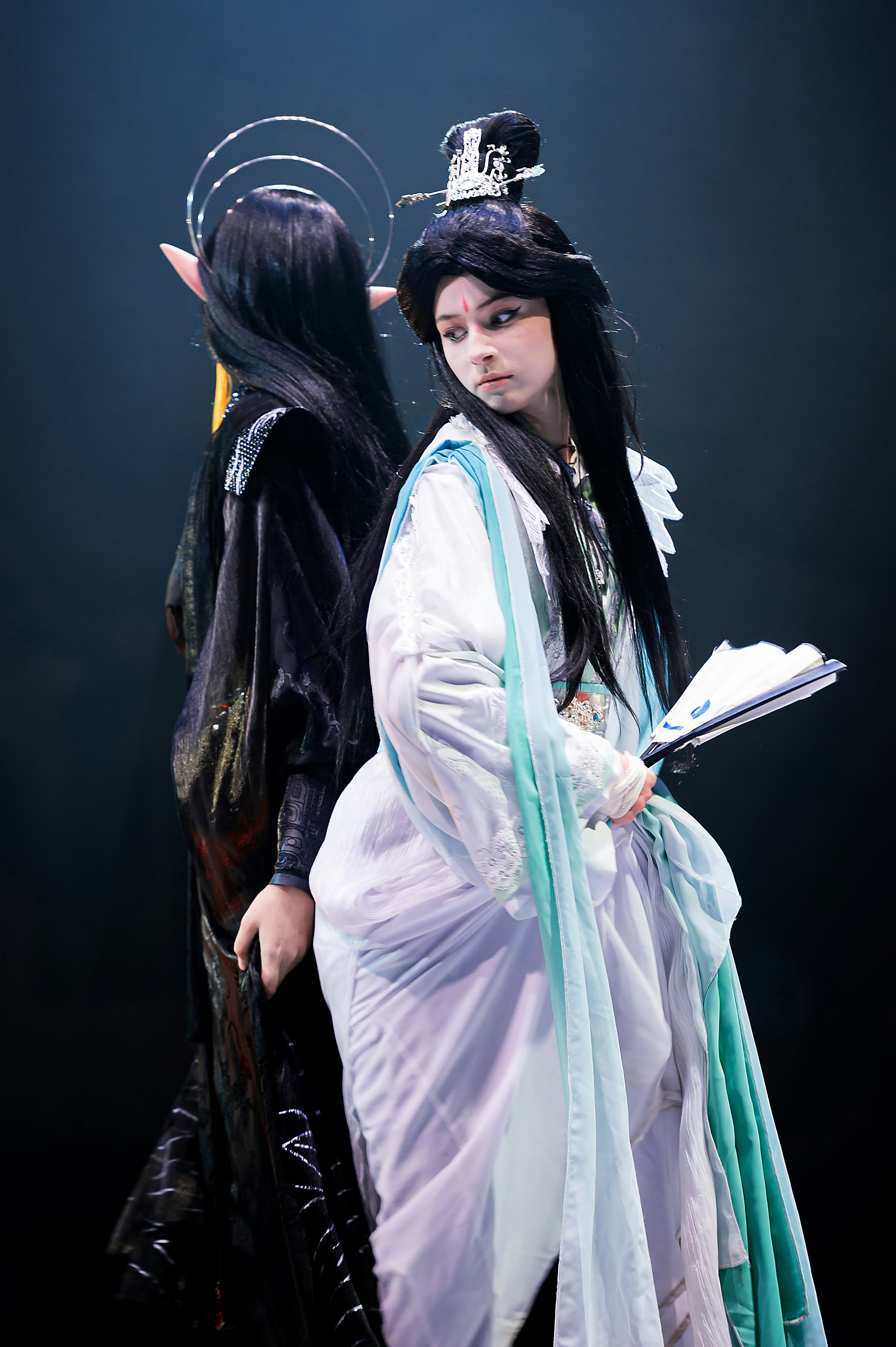 Moonlit Silk: A Dual Portrait of Opera-Inspired Attire on Stage