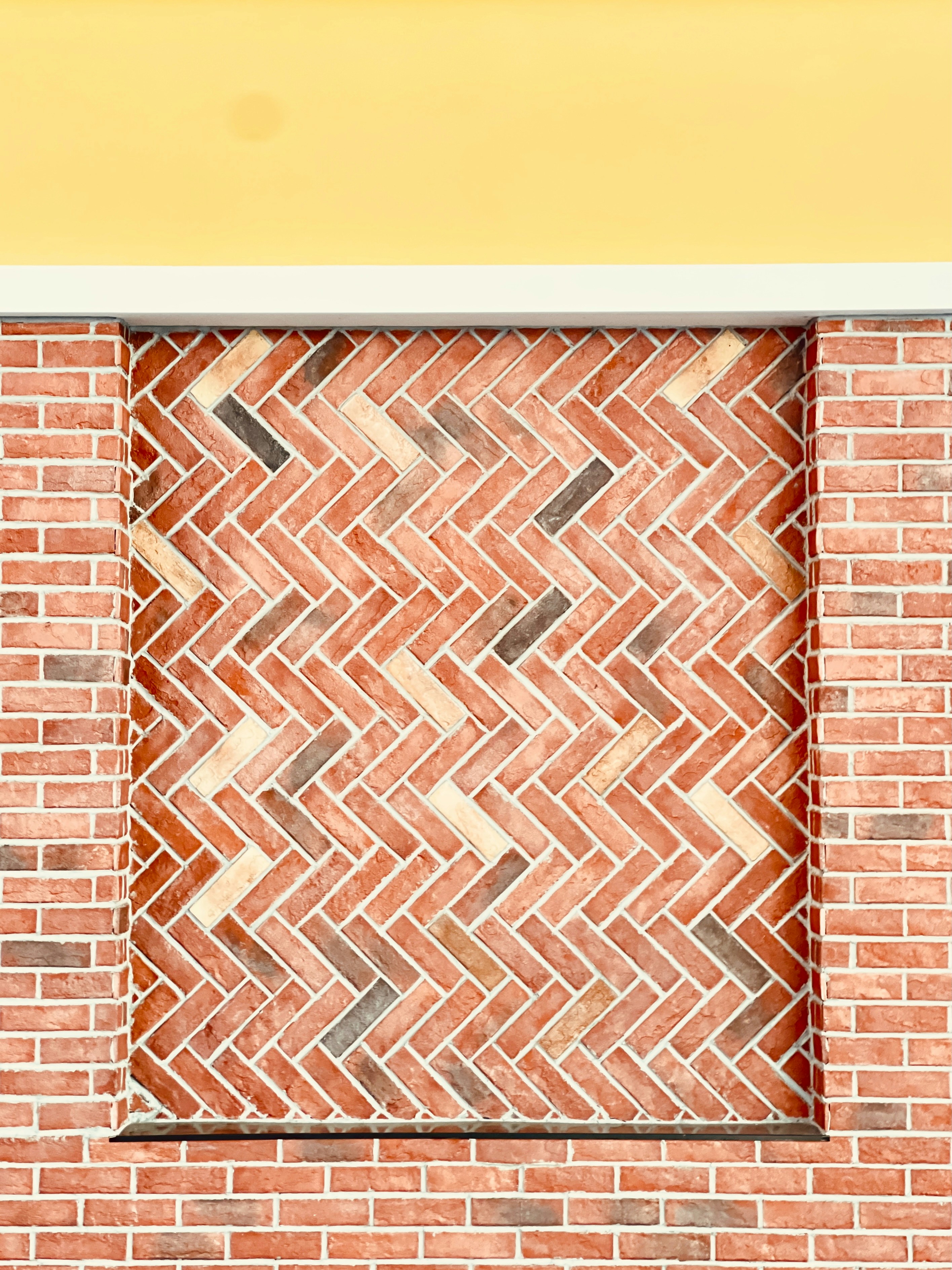 Herringbone Brickwork Framed by a Sunny Lintel