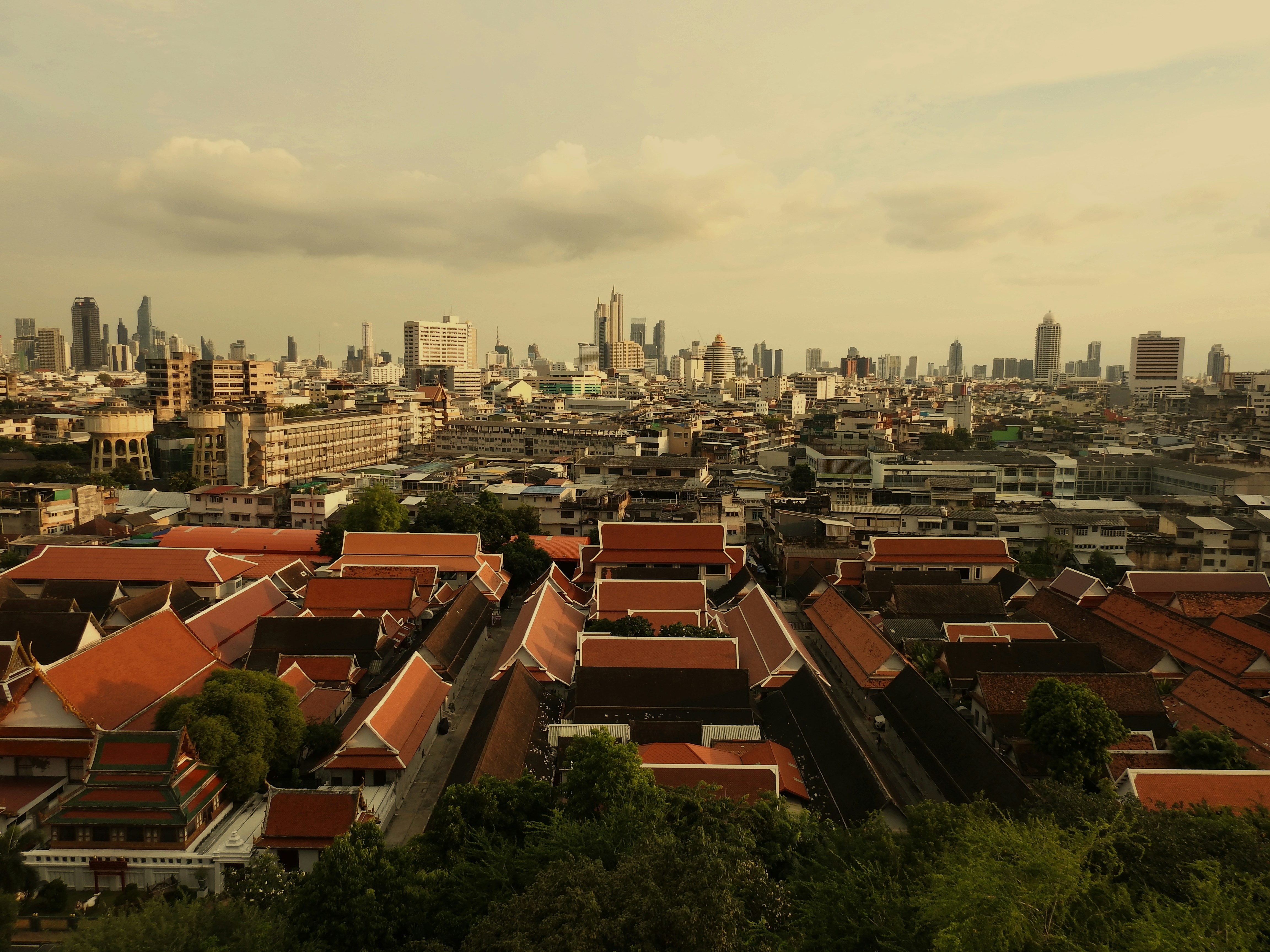 Terracotta Canopies Over a Glass-Horizon Cityscape