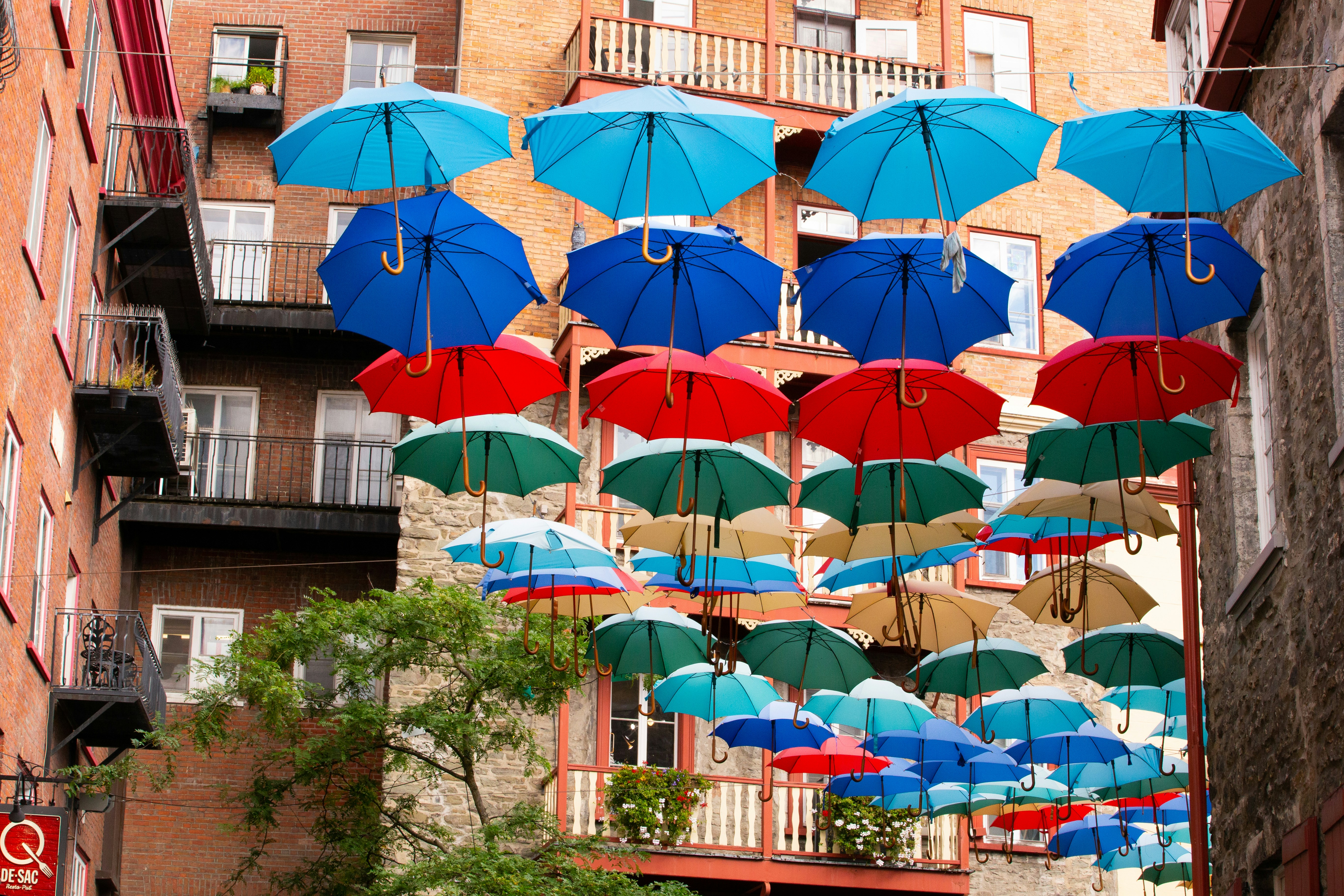 Floating Umbrella Canopy Over a Brick Street