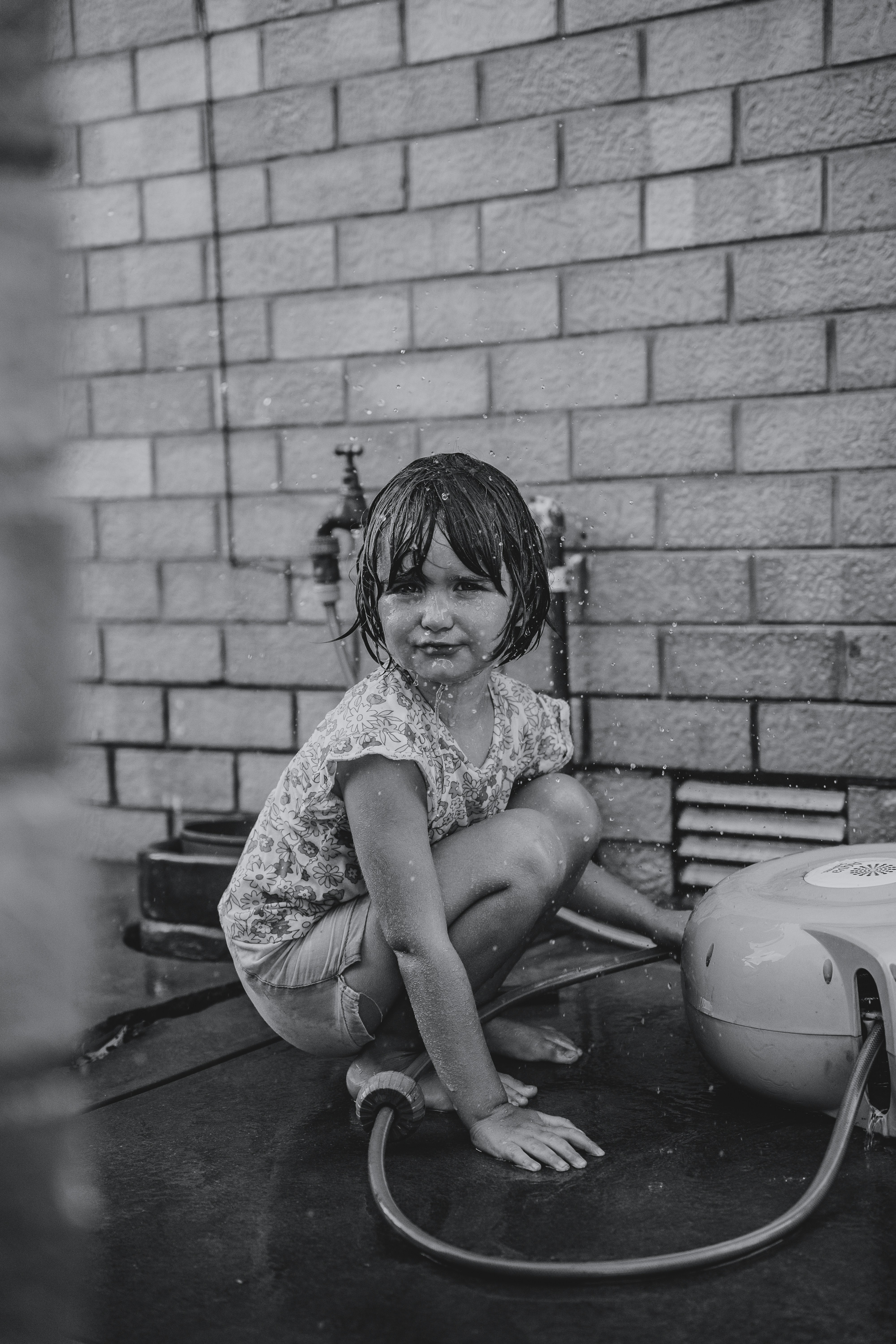 Wet Pebbles, Soft Gaze: A Quiet Moment by the Tap