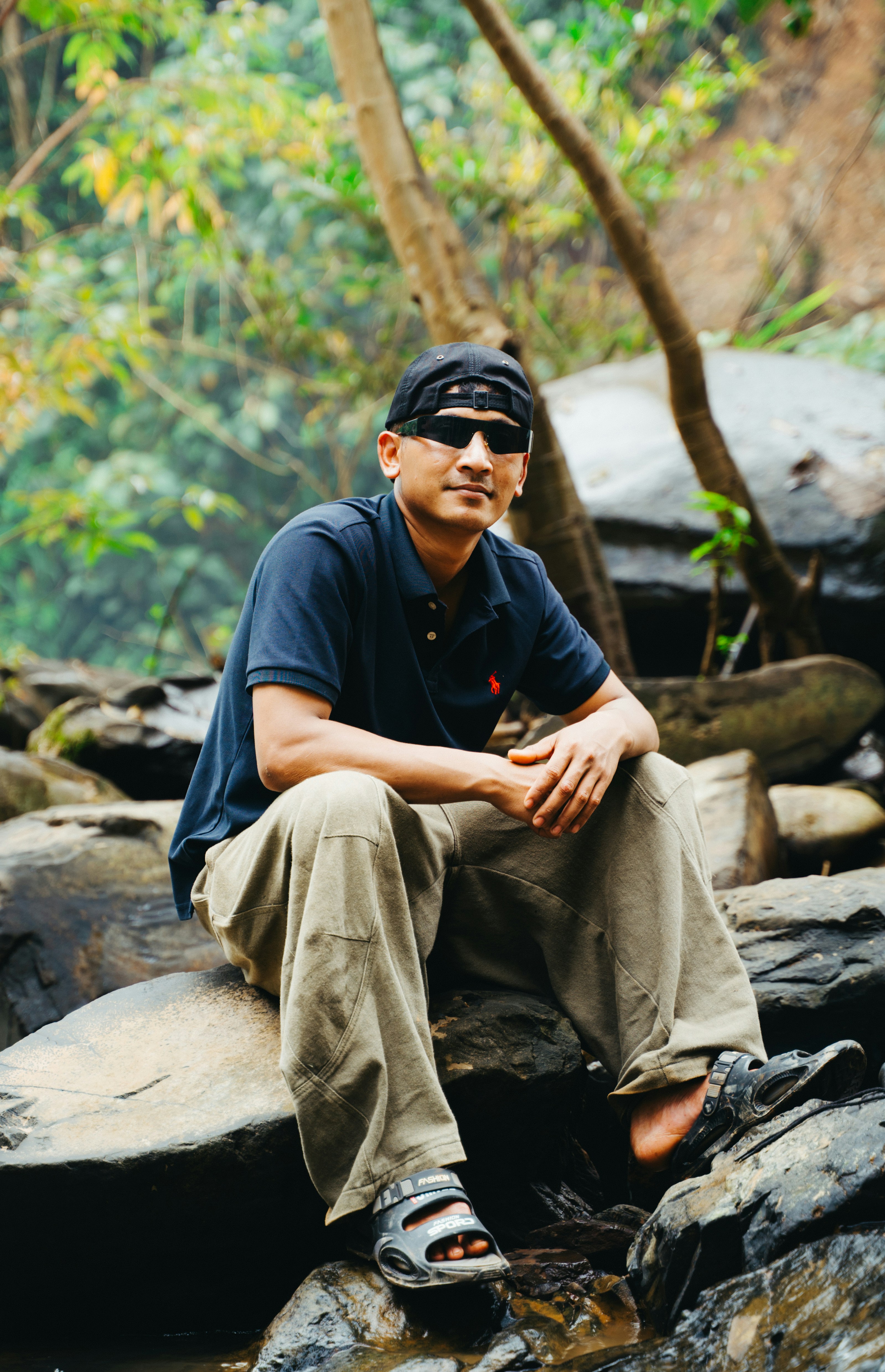 On Mossy Rocks by the Forest Stream: A Quiet Portrait